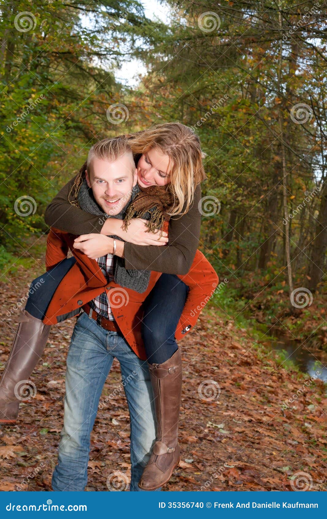 Young Couple is Riding Piggyback Stock Photo - Image of happy, fall ...