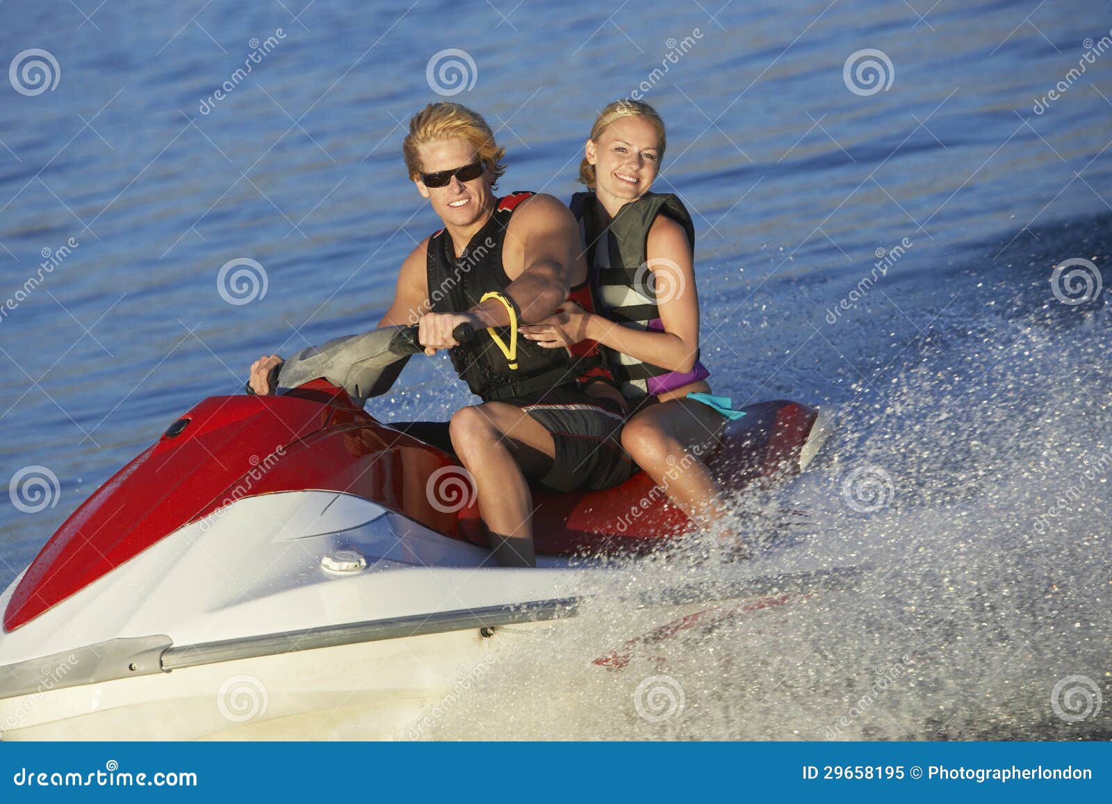 Young Couple Riding PWC on Lake Stock Image - Image of lake, couple ...