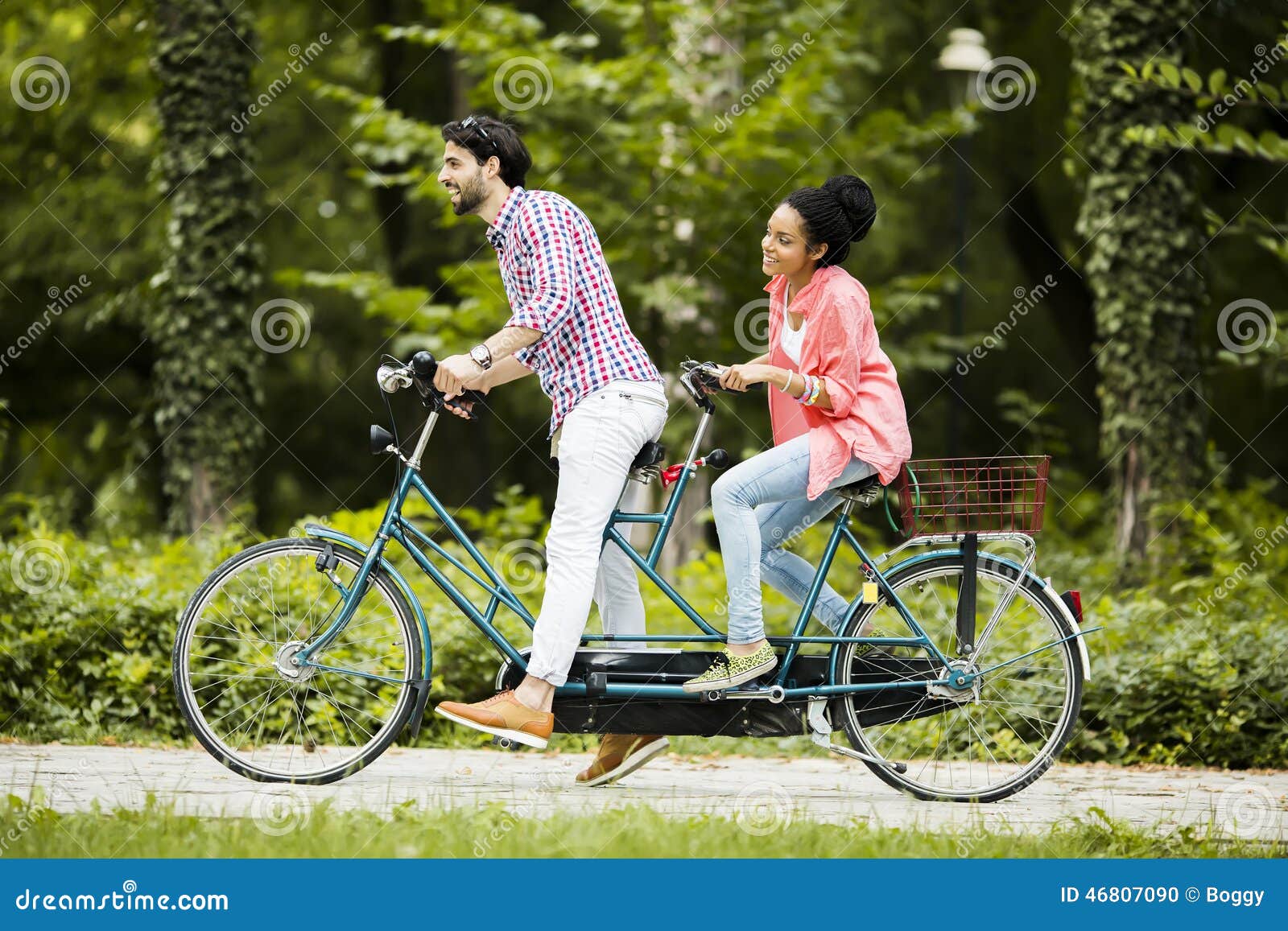 Young Couple Riding on the Tandem Bicycle Stock Photo - Image of ...