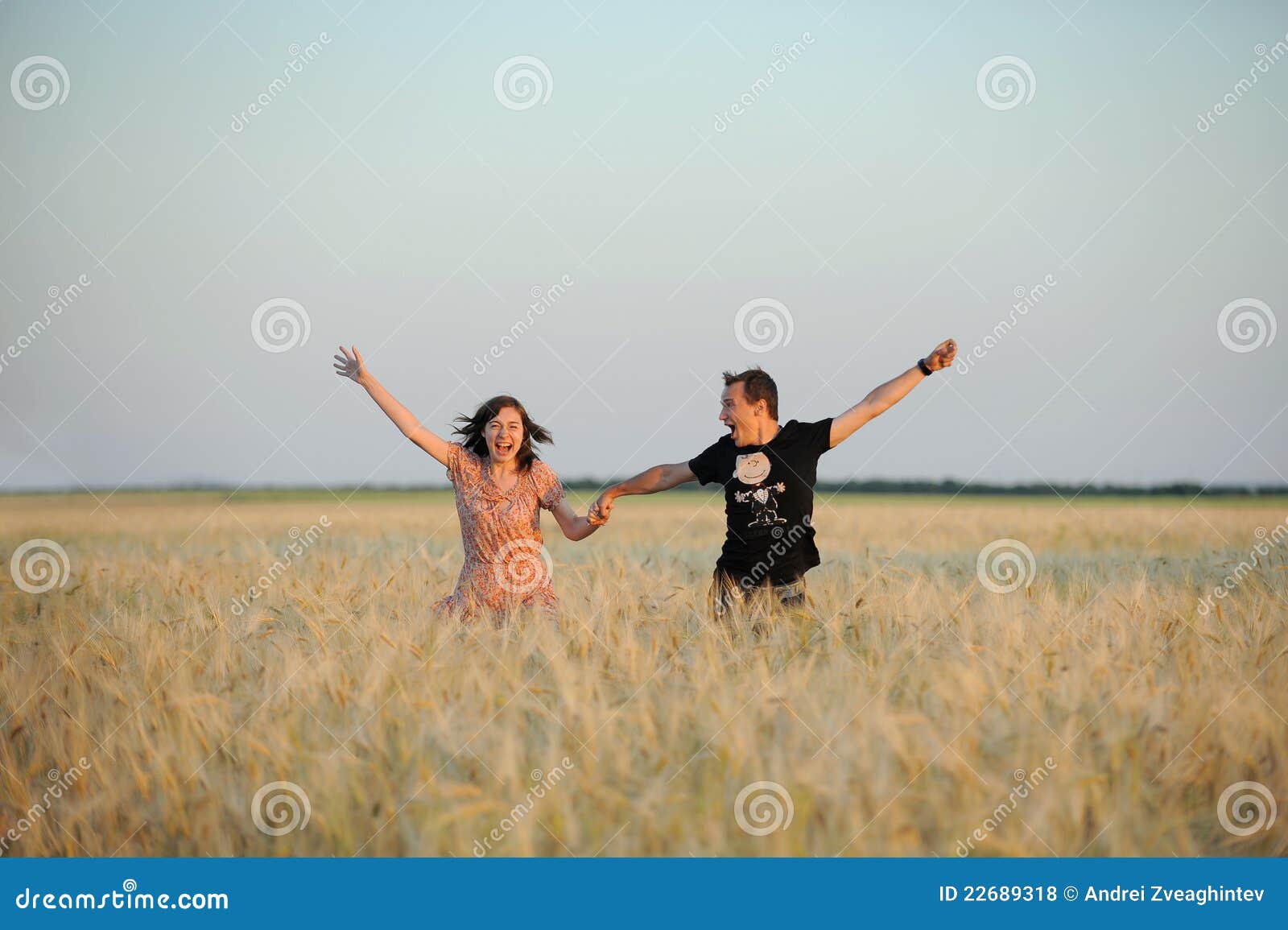 Young Couple Running in a Field Stock Photo - Image of happy, activity ...