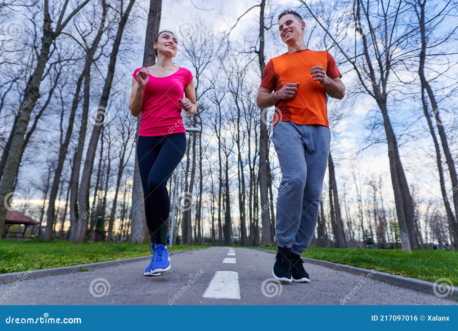 Young Couple Running in the Park Stock Photo - Image of leisure ...