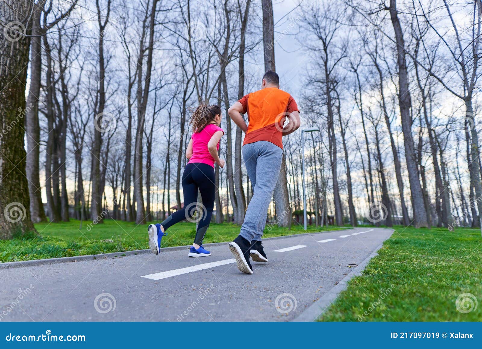 Young Couple Running in the Park Stock Image - Image of real, people ...