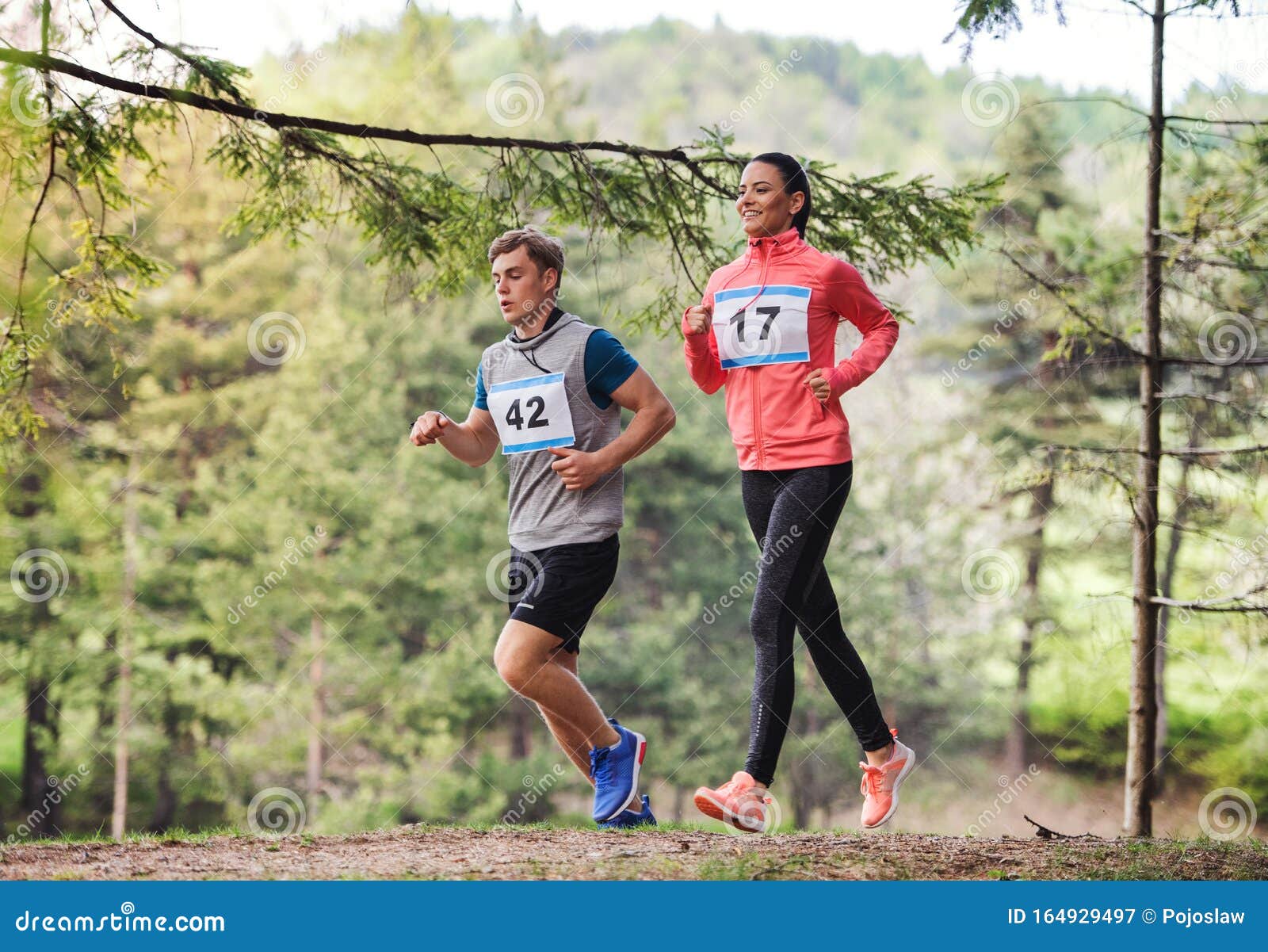 Young Couple Running a Race Competition in Nature. Stock Image - Image ...