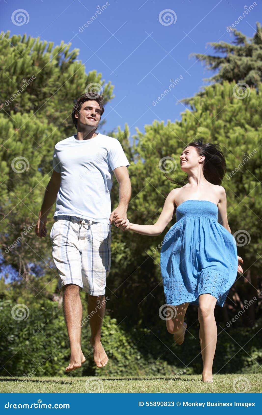 Young Couple Running through Summer Field Stock Image - Image of full ...