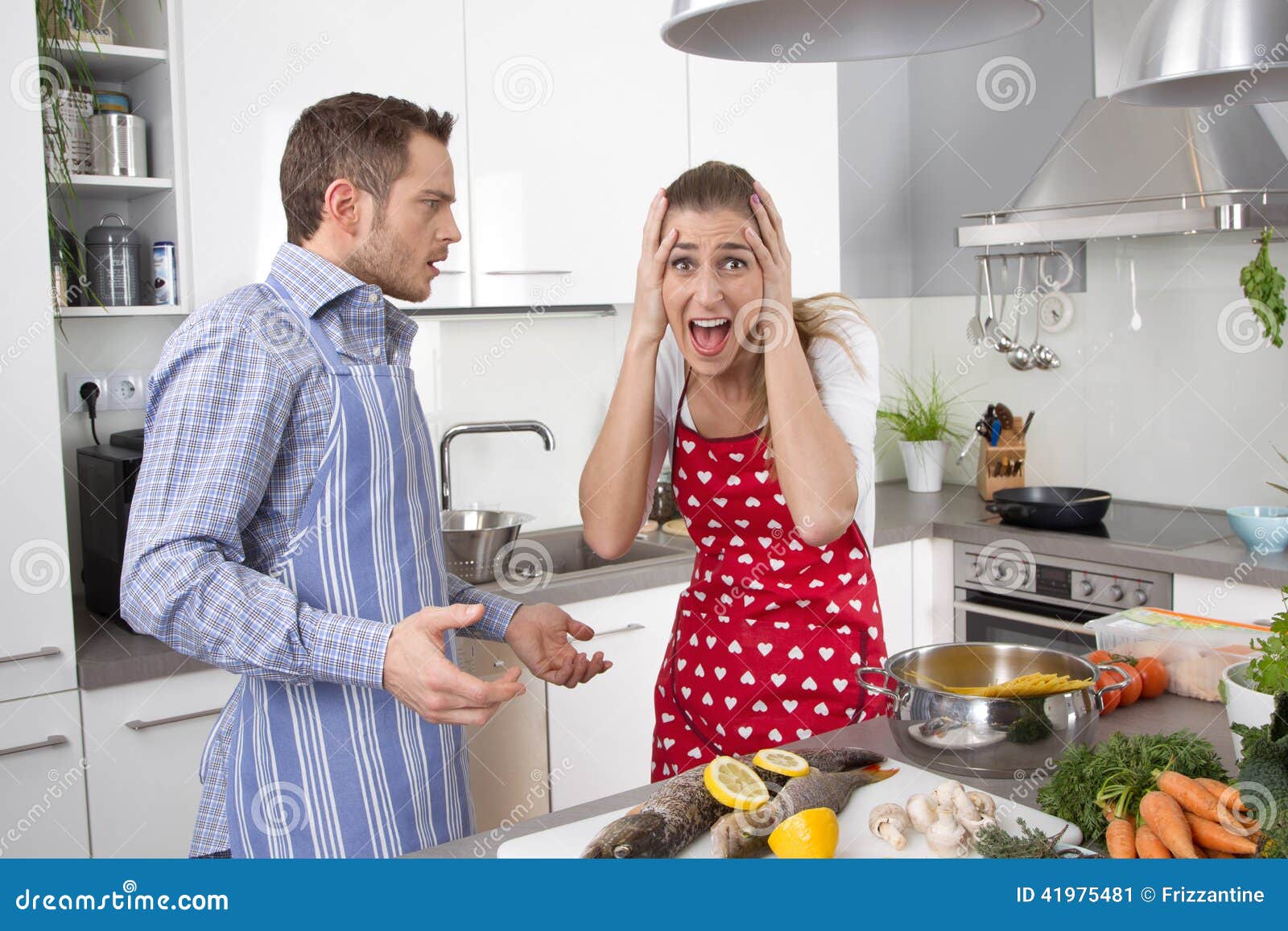 Young Couple Screaming at Home in the Kitchen. Stock Image - Image of ...
