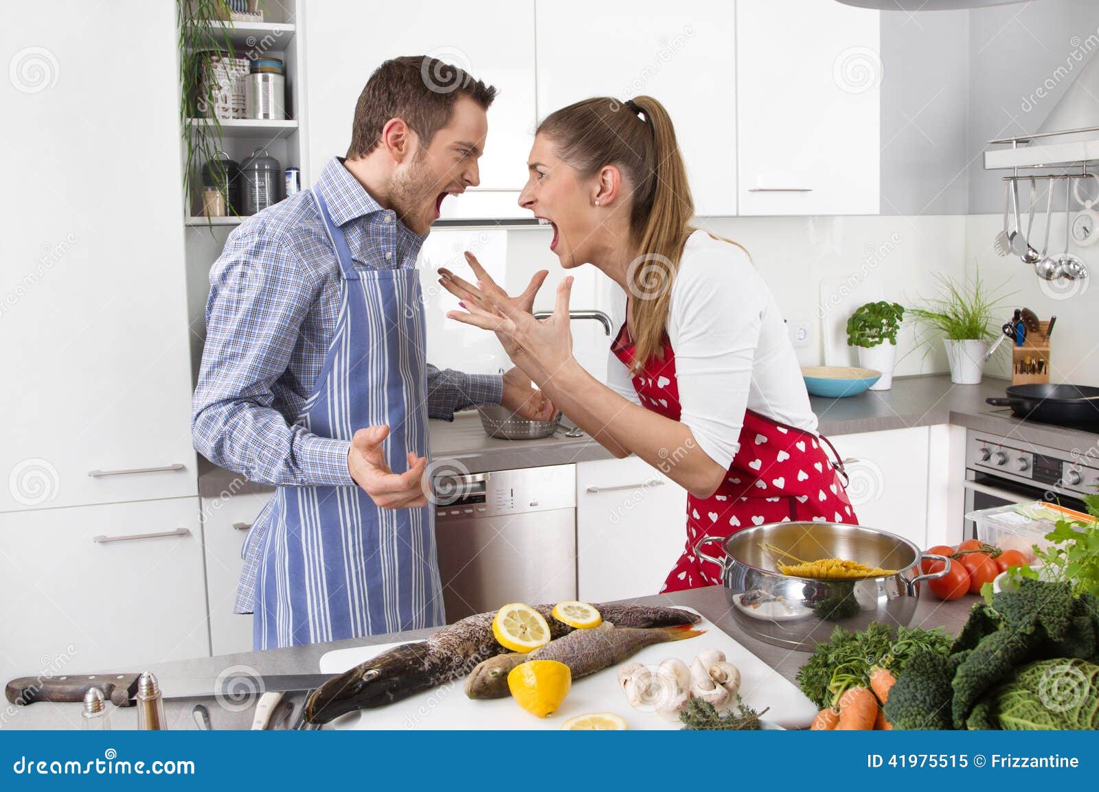 Young Couple Screaming at Home in the Kitchen. Stock Image - Image of ...