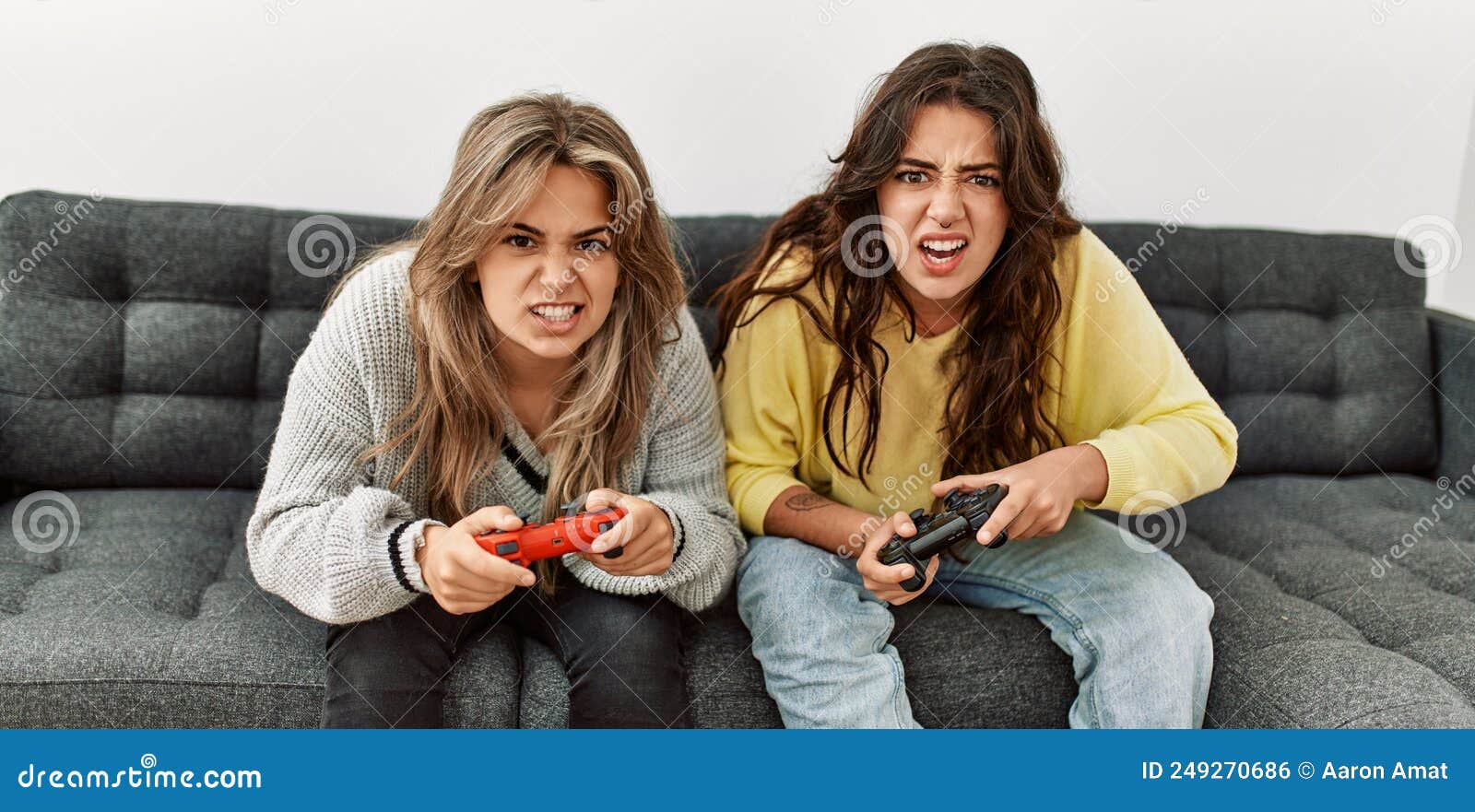 Young Couple Screaming and Playing Video Game at Home Stock Photo ...