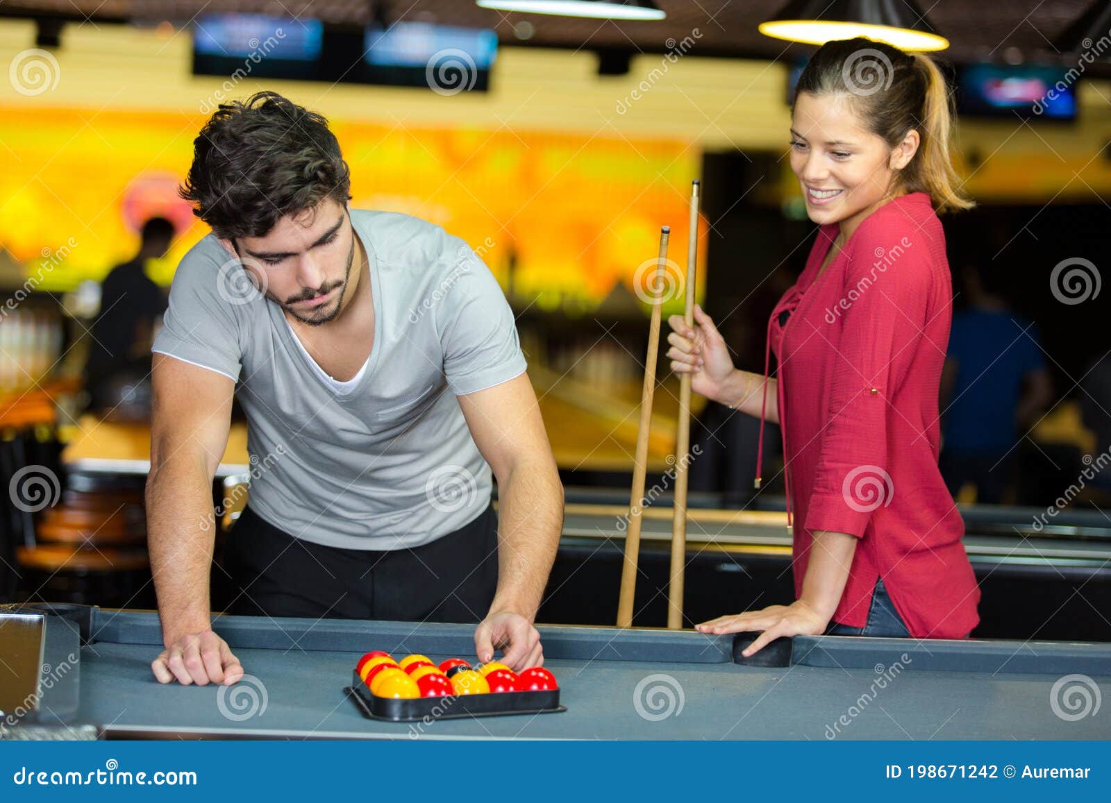 Young Couple Setting Up for Game Pool Stock Photo - Image of stick ...
