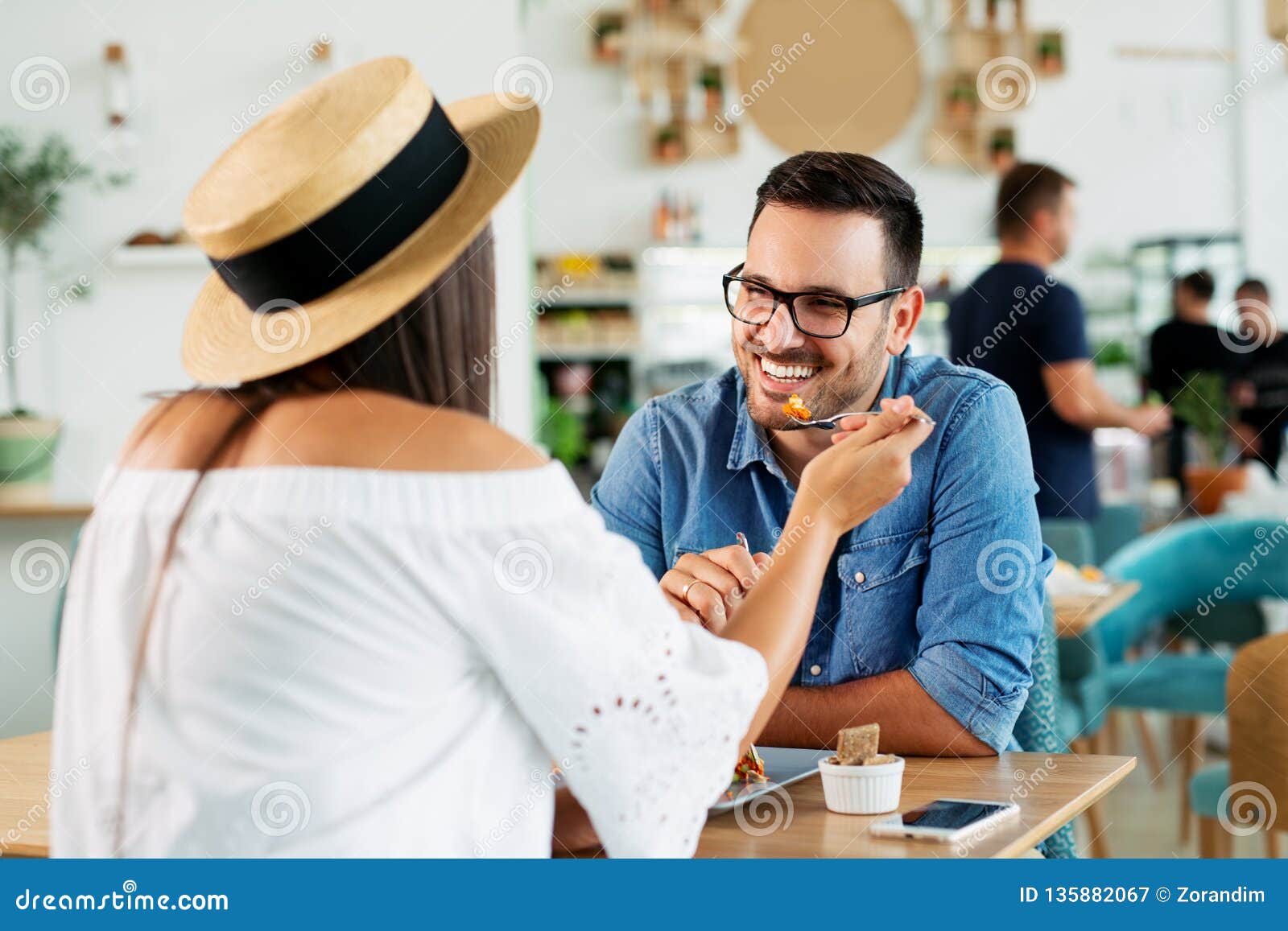 Young Couple Sharing Meal in a Cafe. - Image Stock Image - Image of ...