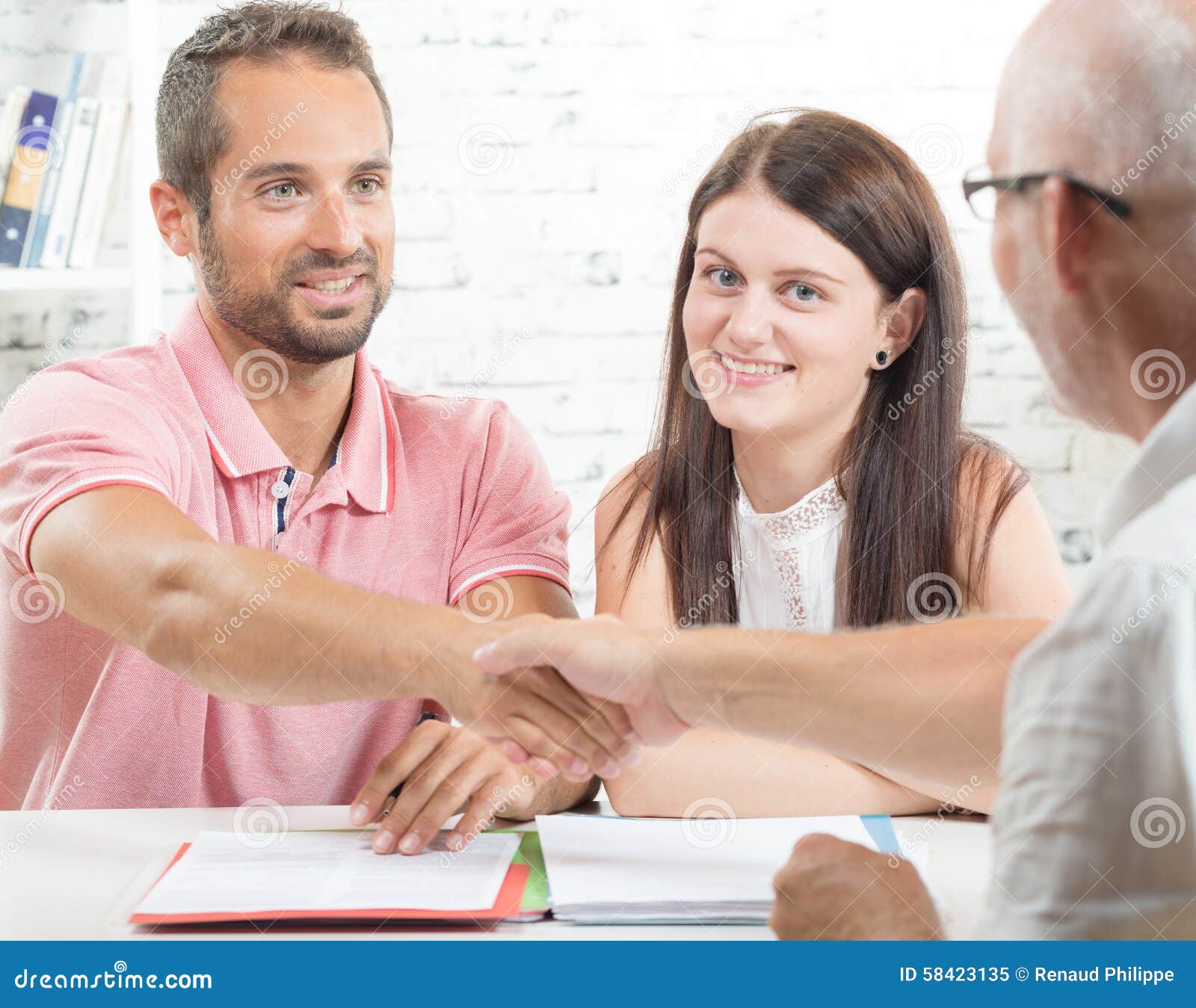 A Young Couple Signs a Contract Stock Image - Image of girl, couple ...
