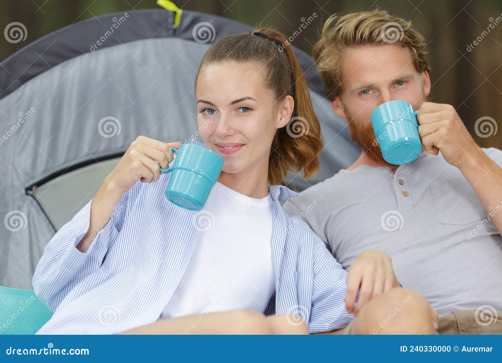 Young Couple Sipping Drink from Plastic Mug Stock Photo - Image of ...