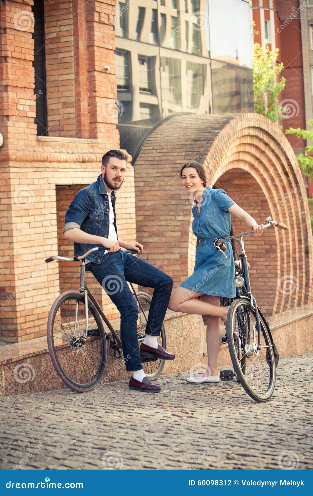 Young Couple Sitting on a Bicycle Opposite City Stock Photo - Image of ...