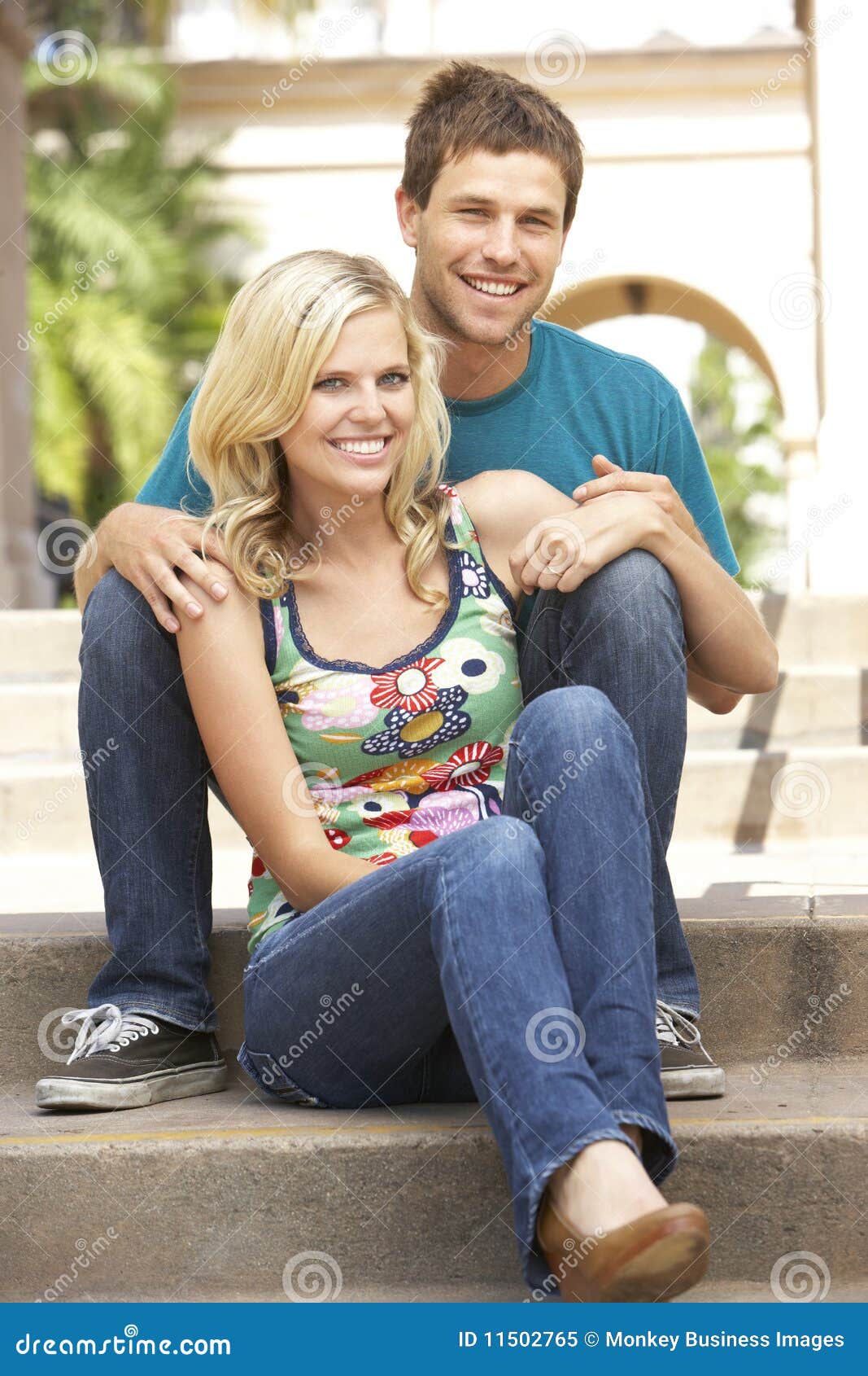 Young Couple Sitting on Steps of Building Stock Image - Image of ...