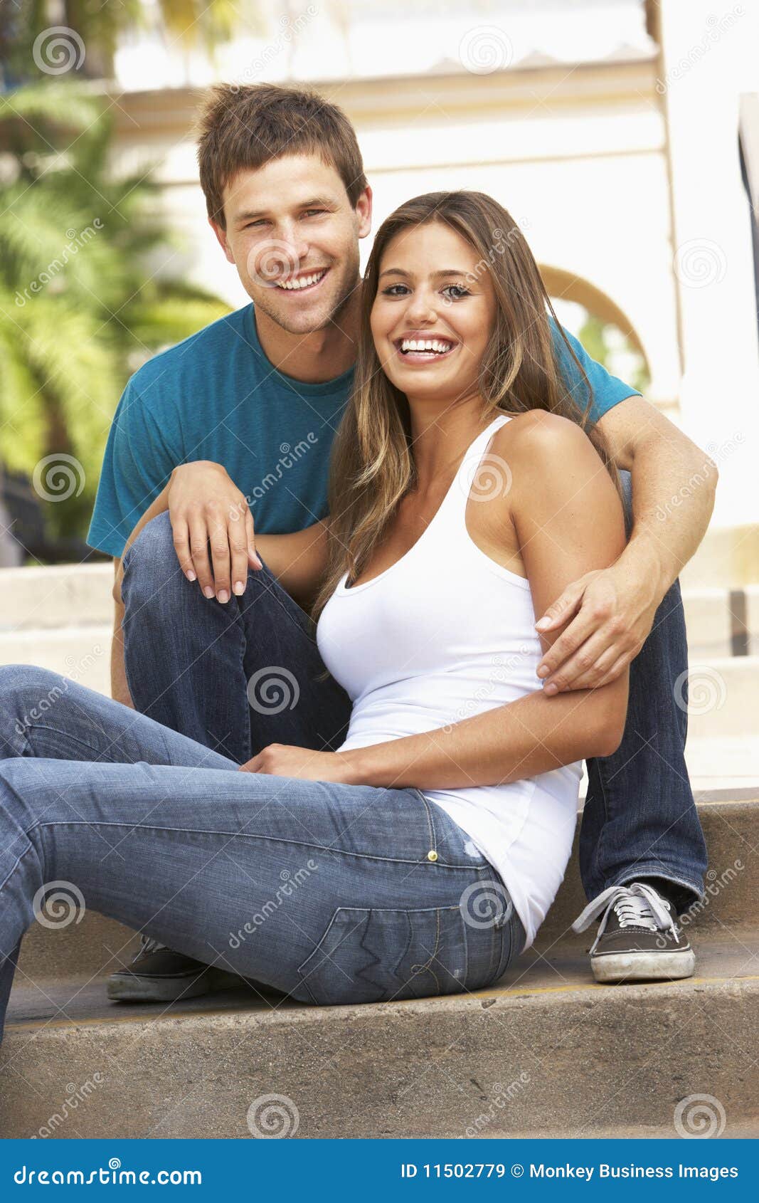 Young Couple Sitting on Steps of Building Stock Image - Image of ...