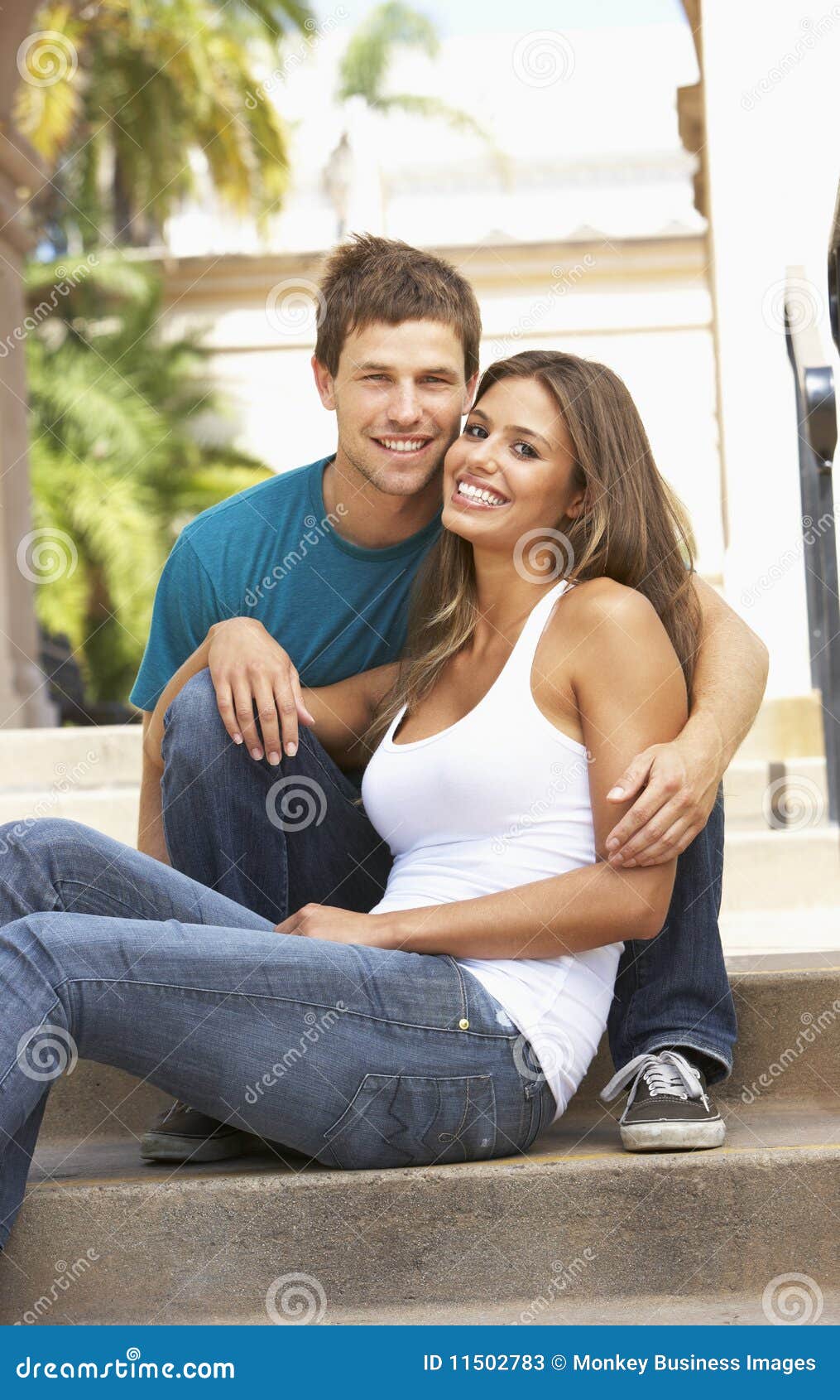 Young Couple Sitting on Steps of Building Stock Image - Image of ...