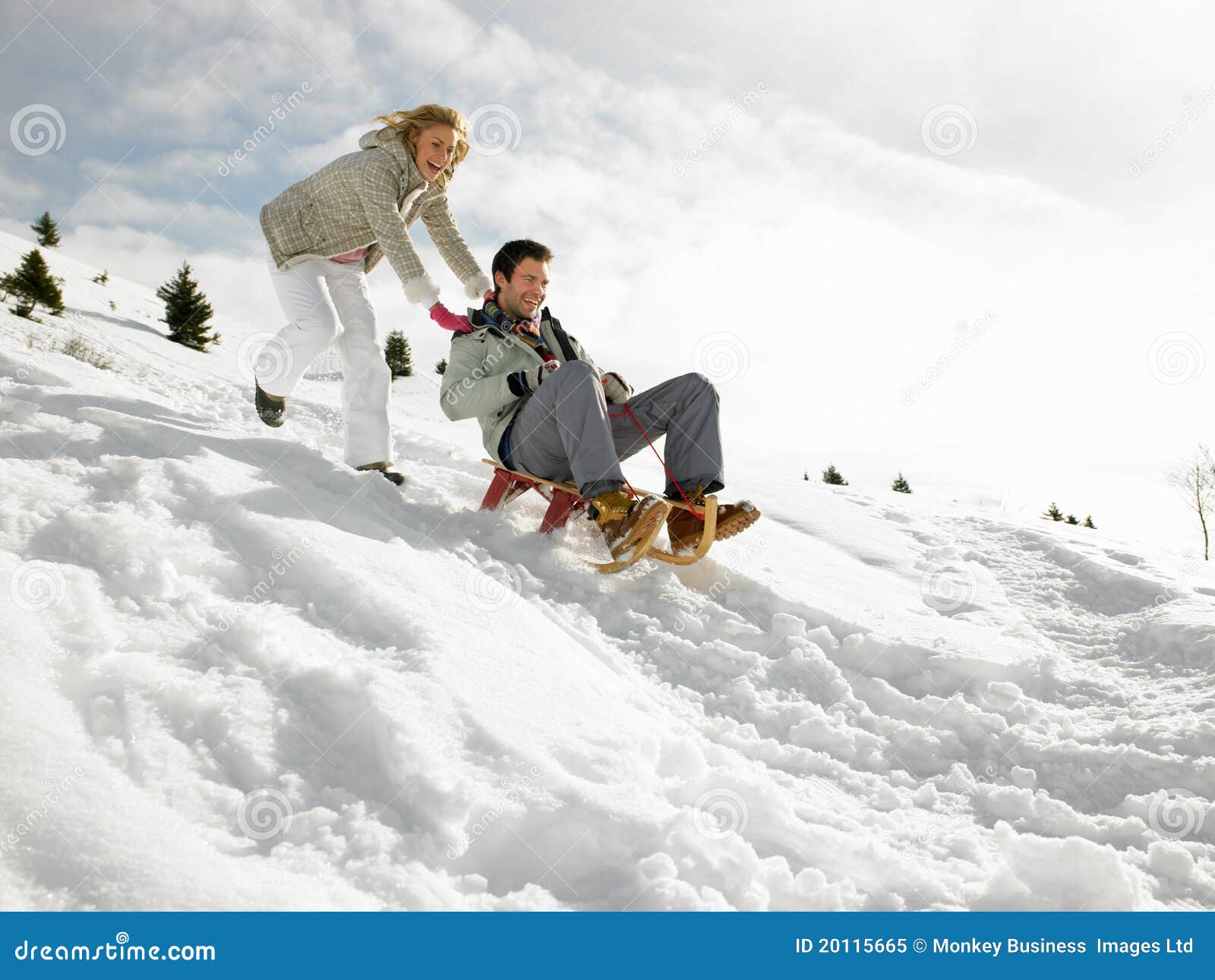 Young Couple Sledding stock image. Image of portrait - 20115665