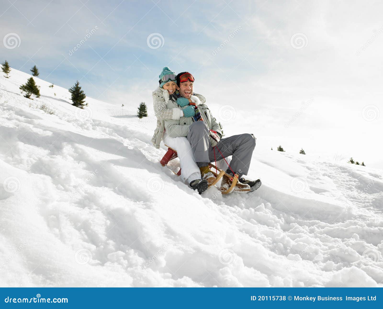 Young Couple Sledding stock photo. Image of slope, horizontal - 20115738