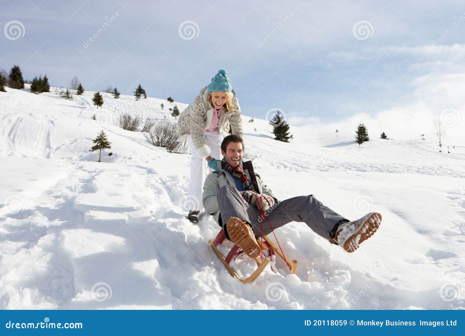 Young Couple Sledding stock image. Image of slope, male - 20118059