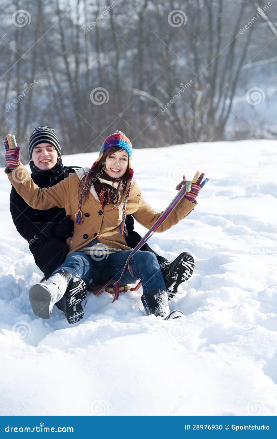 Young Couple Sledding on Snow Stock Photo - Image of love ...