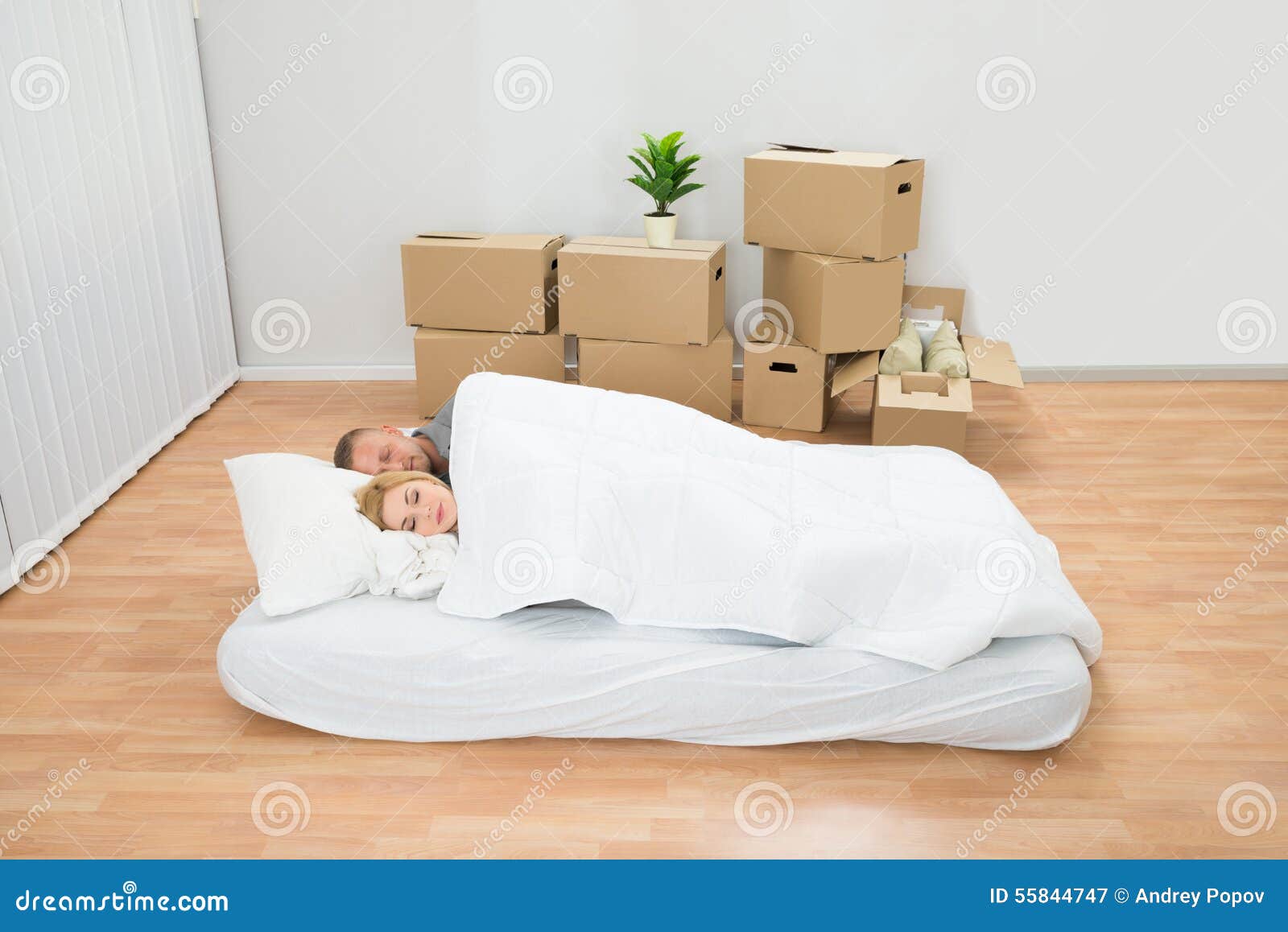 Young Couple Sleeping on Mattress Stock Image - Image of floor, leisure ...