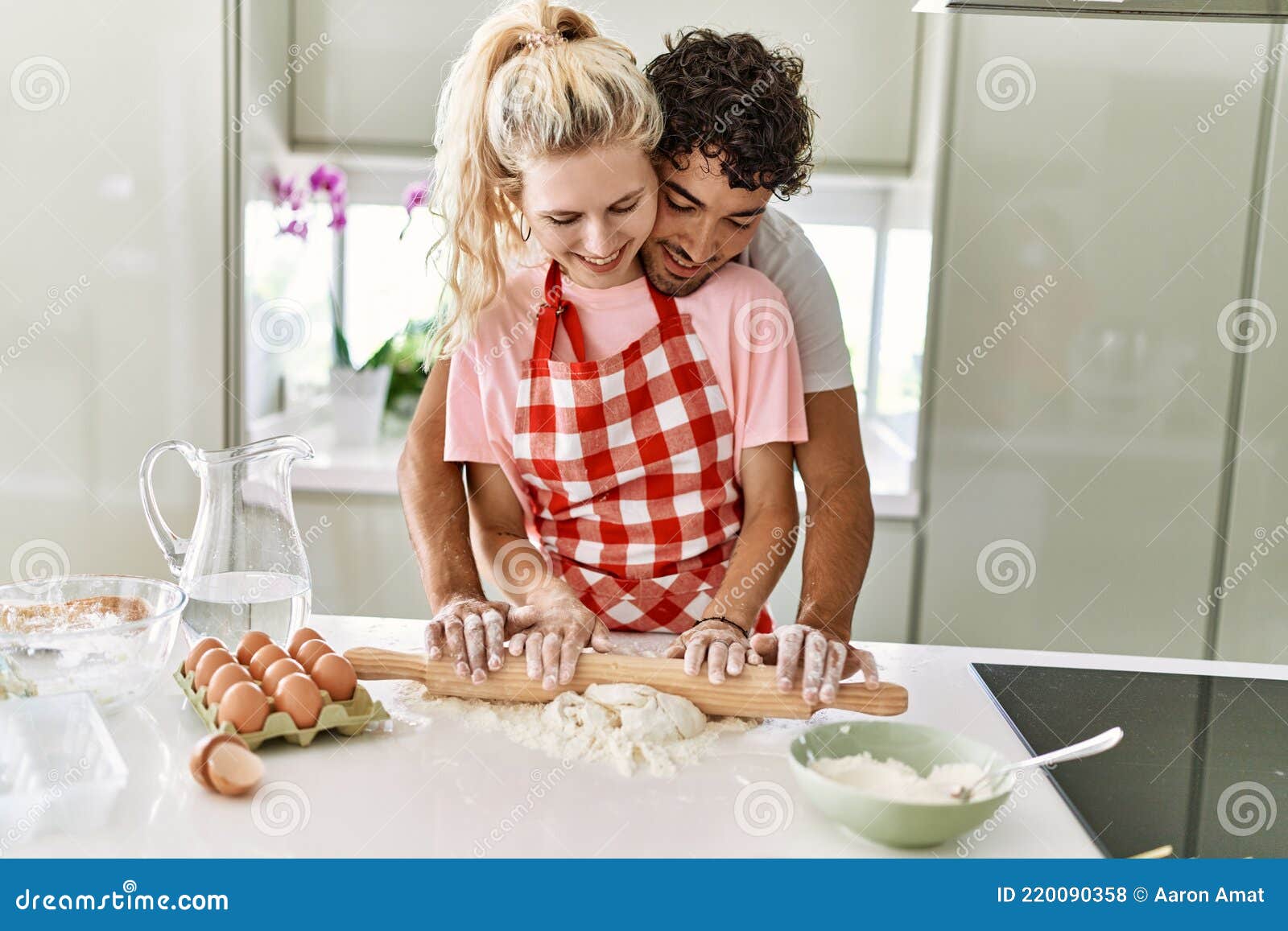Young Couple Smiling Happy Kneading Dough with Hands at Kitchen Stock ...