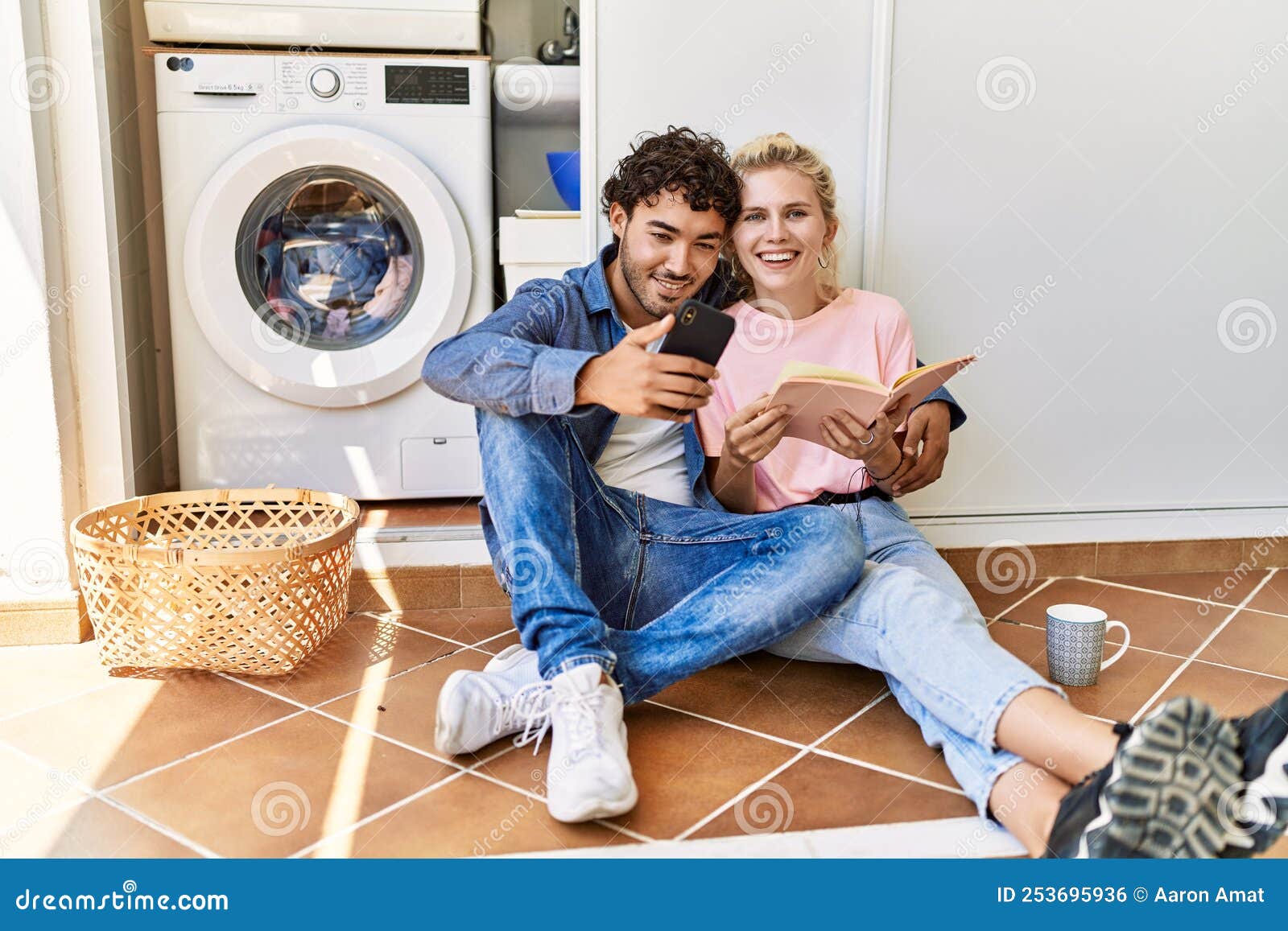Young Couple Smiling Happy Reading Book and Using Smartphone while ...