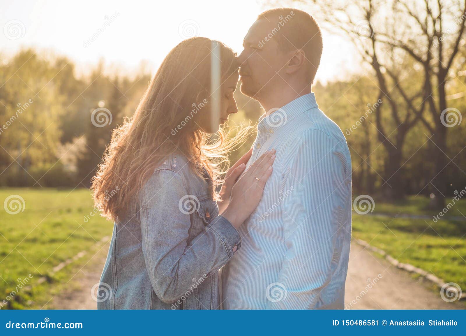A Young Couple Spends Time Together Outdoors. Couple Having Fun Summer ... A Young Couple Spends Time Together Outdoors. Couple Having Fun Summer ...