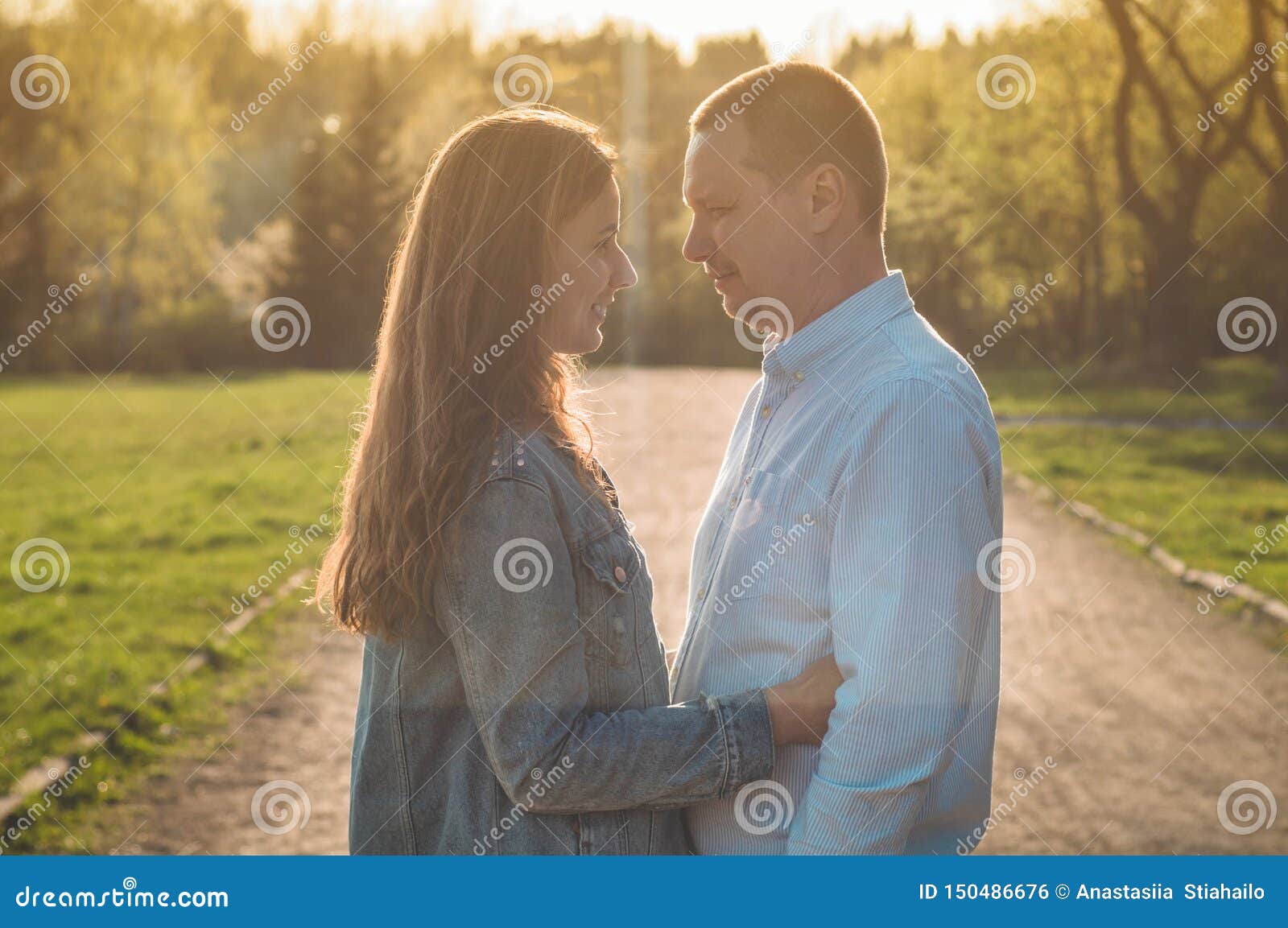 A Young Couple Spends Time Together Outdoors. Couple Having Fun Summer ... A Young Couple Spends Time Together Outdoors. Couple Having Fun Summer ...