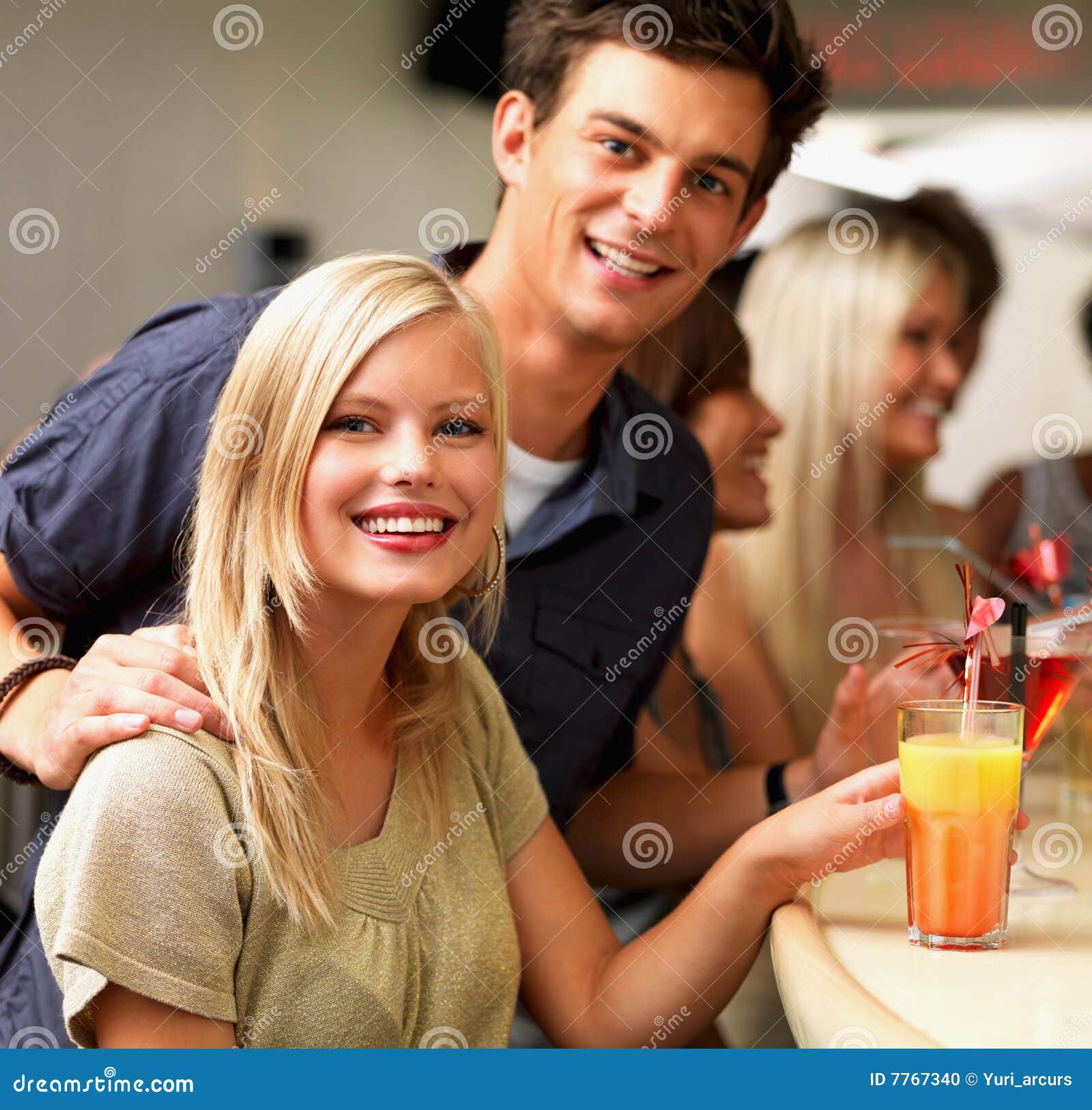 Young Couple Standing at a Bar Sharing a Drink Stock Photo - Image of ...