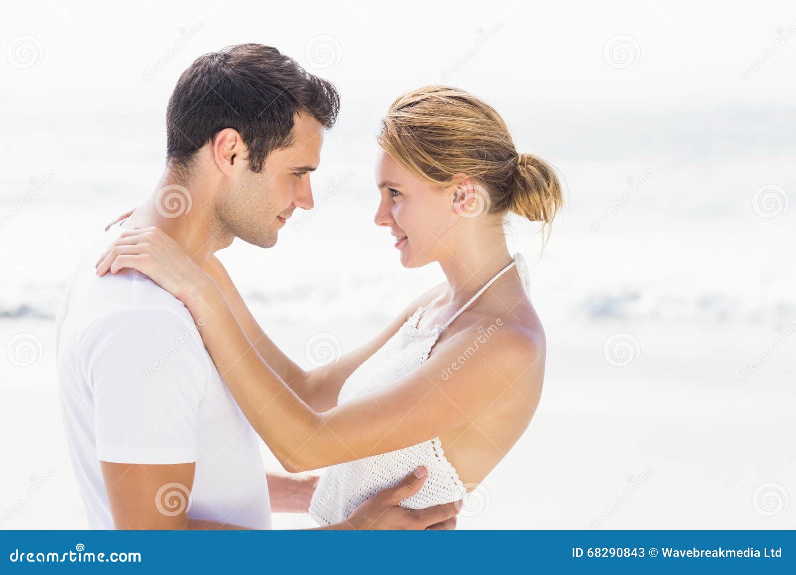 Young Couple Standing Face To Face and Romancing Stock Image - Image of ...