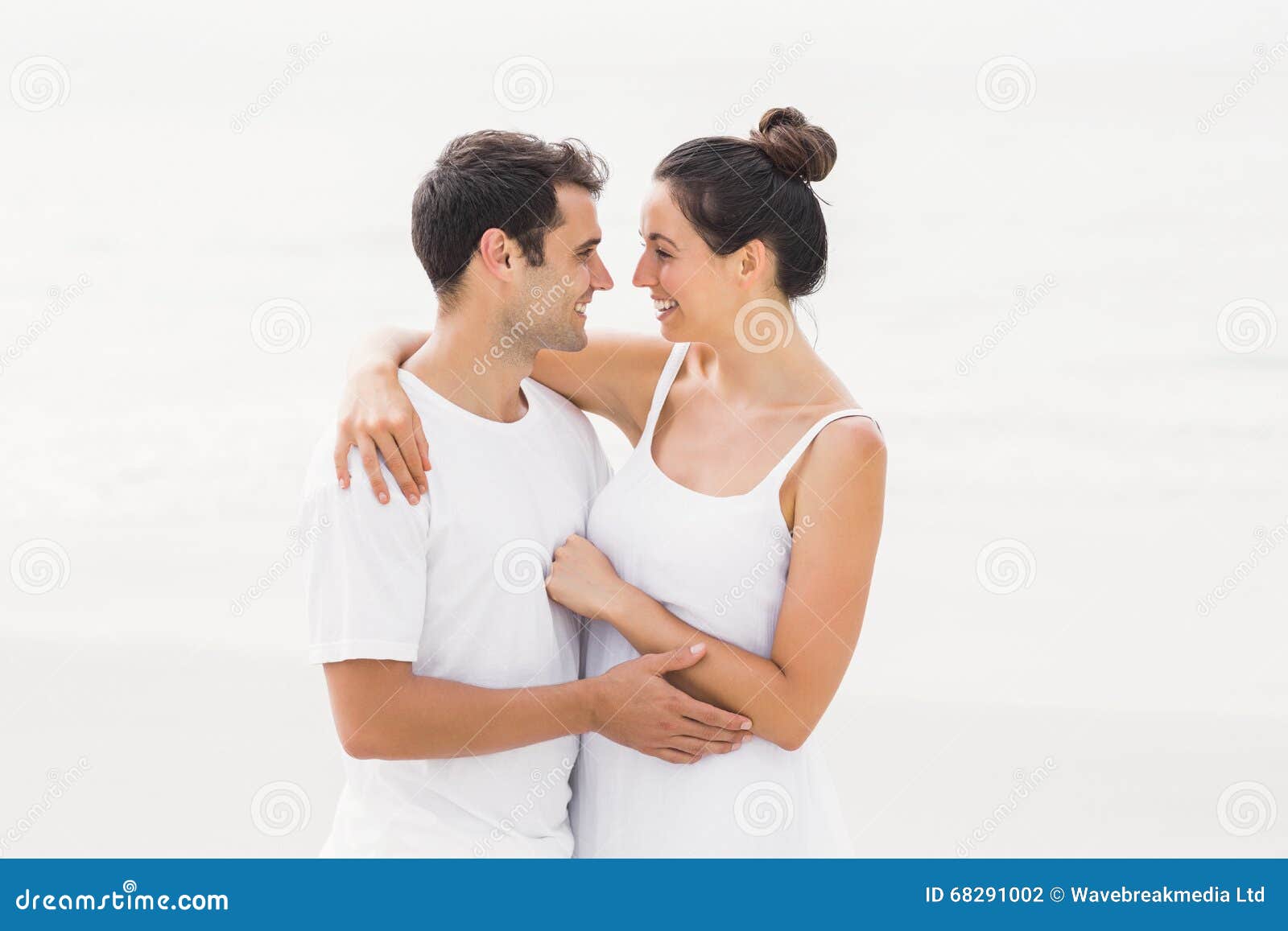Young Couple Standing Face To Face and Romancing Stock Photo - Image of ...