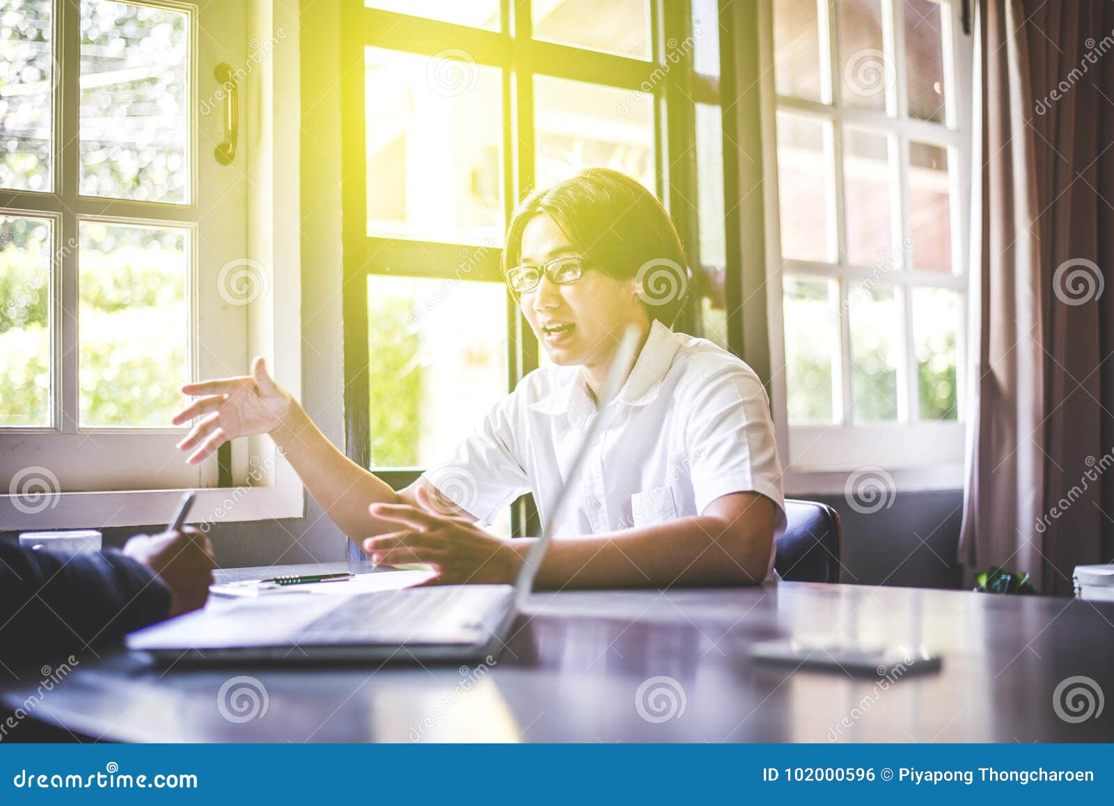 Young Couple Student Discussing Things and Working on a Project Stock ...