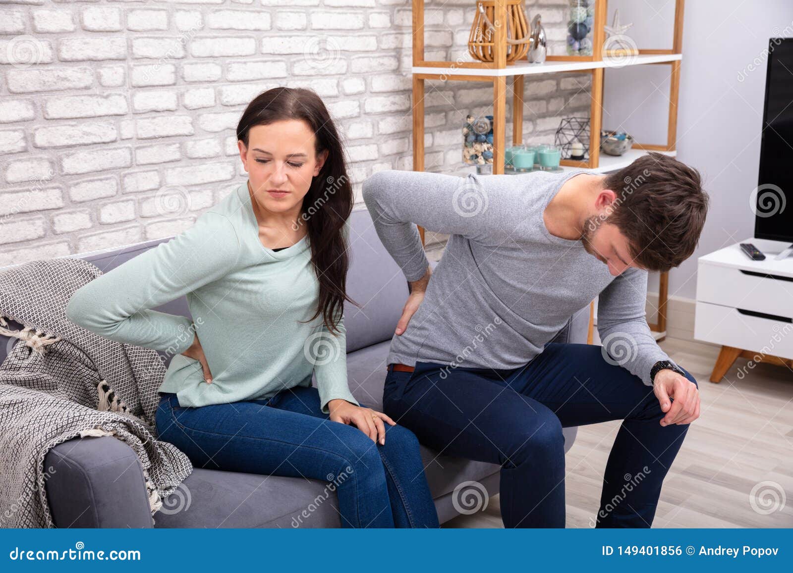 Young Couple Suffering from Backache Stock Photo - Image of couple ...