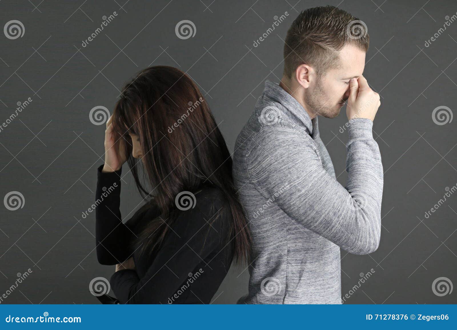 Couple Sulking Each Other Sitting Back To Back On Bed Royalty-Free ...