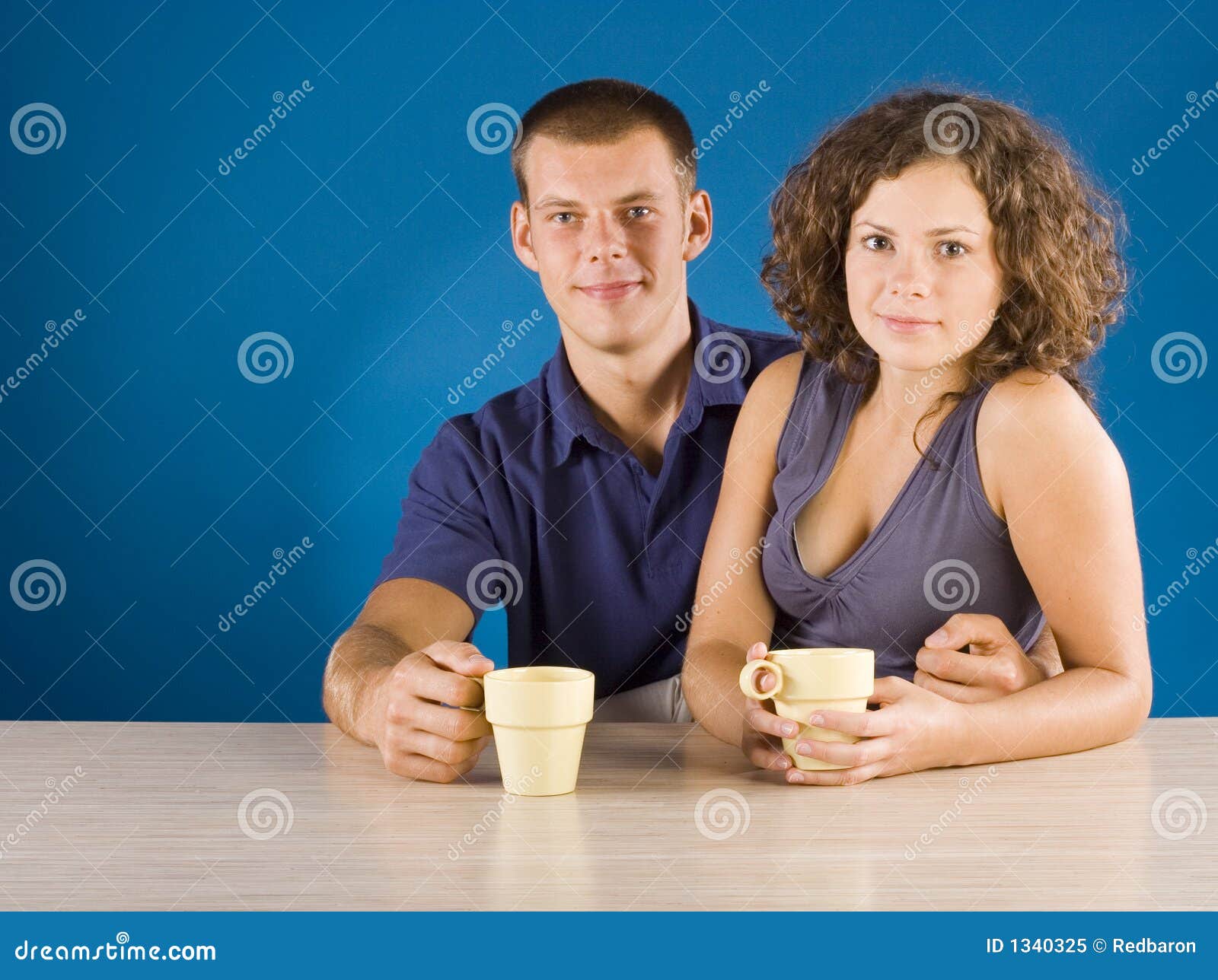 Young couple at the table stock image. Image of family - 1340325