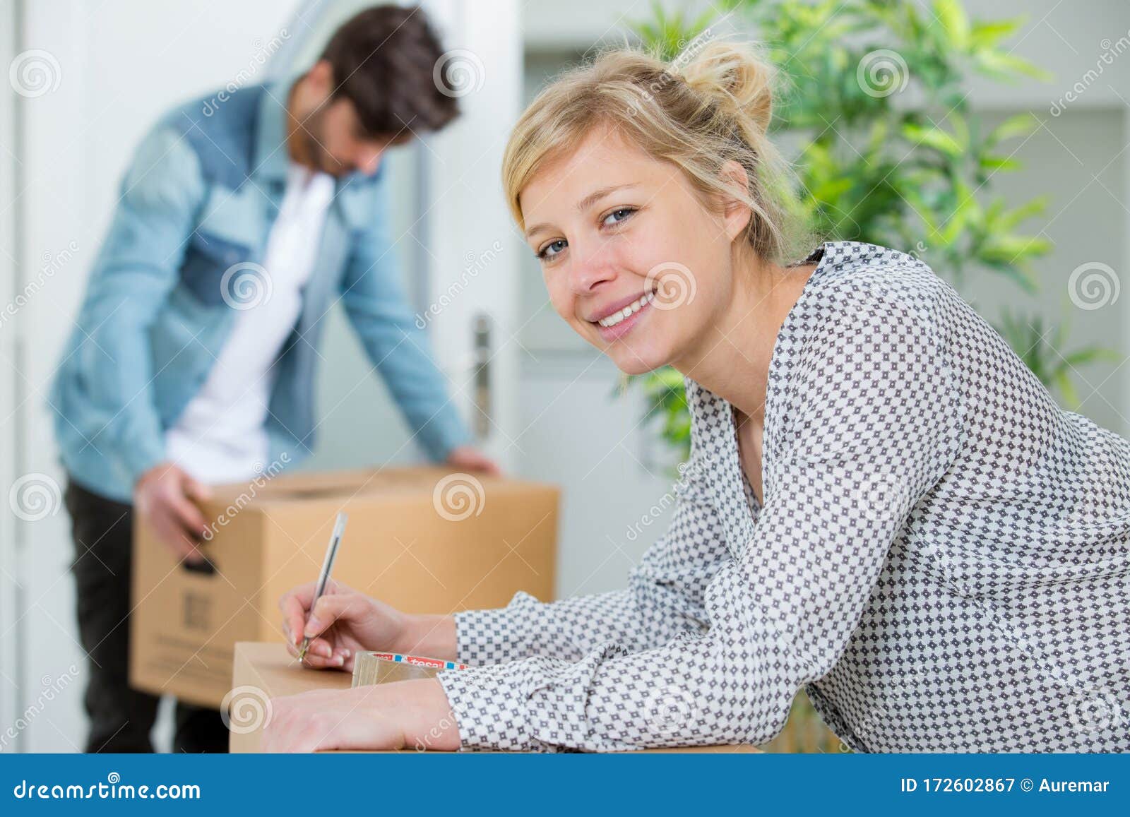 Young Couple Tagging Their Boxes Stock Image - Image of property ...