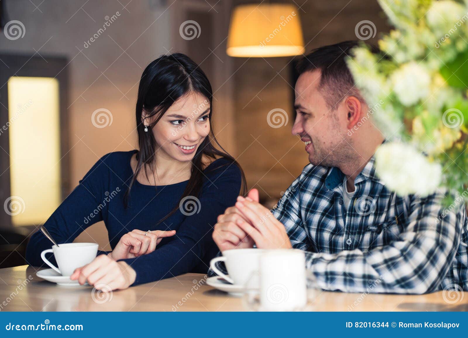 Young Couple Talking in Coffee Shop Stock Photo - Image of laughing ...