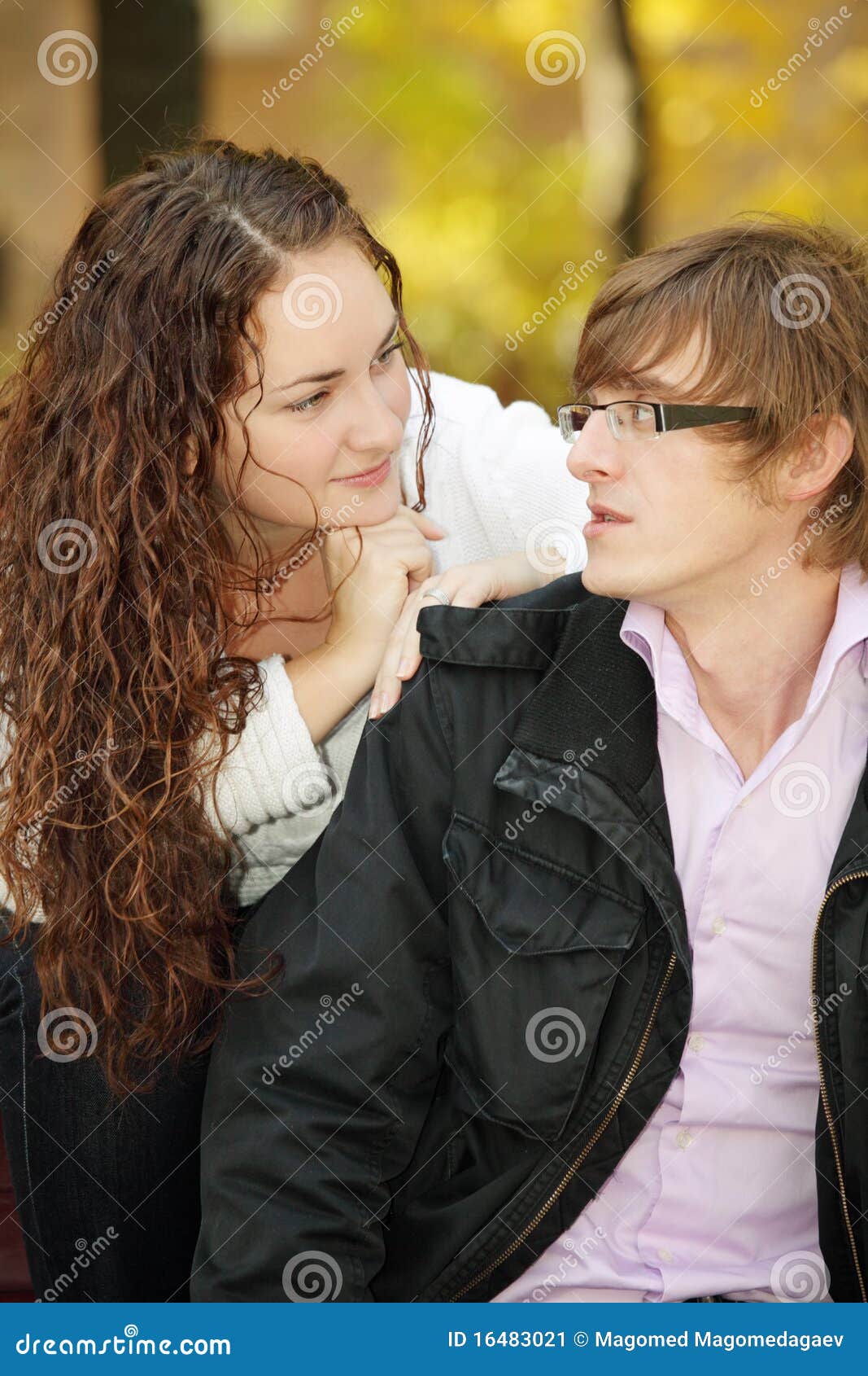 Young Couple Talking in Park Stock Image - Image of talking, eyeglasses ...