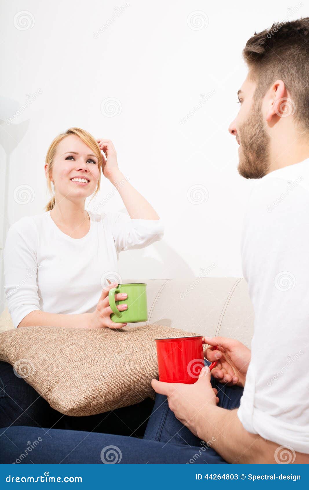 Young Couple Talking on the Sofa Stock Image - Image of living ...