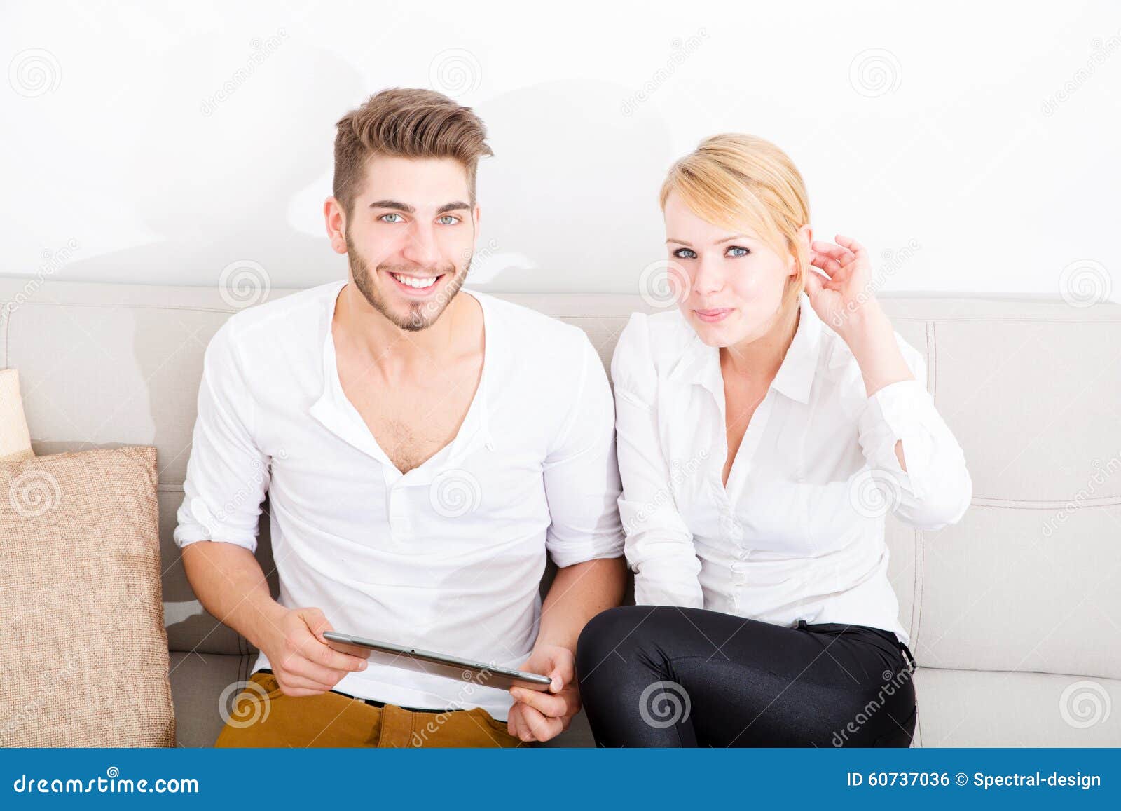 Young Couple Talking on the Sofa Stock Photo - Image of lifestyle ...