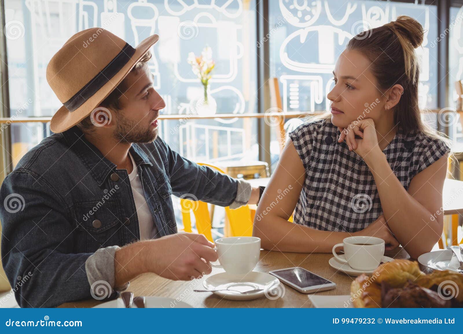 Couple talking at cafe stock photo. Image of lifestyle - 99479232