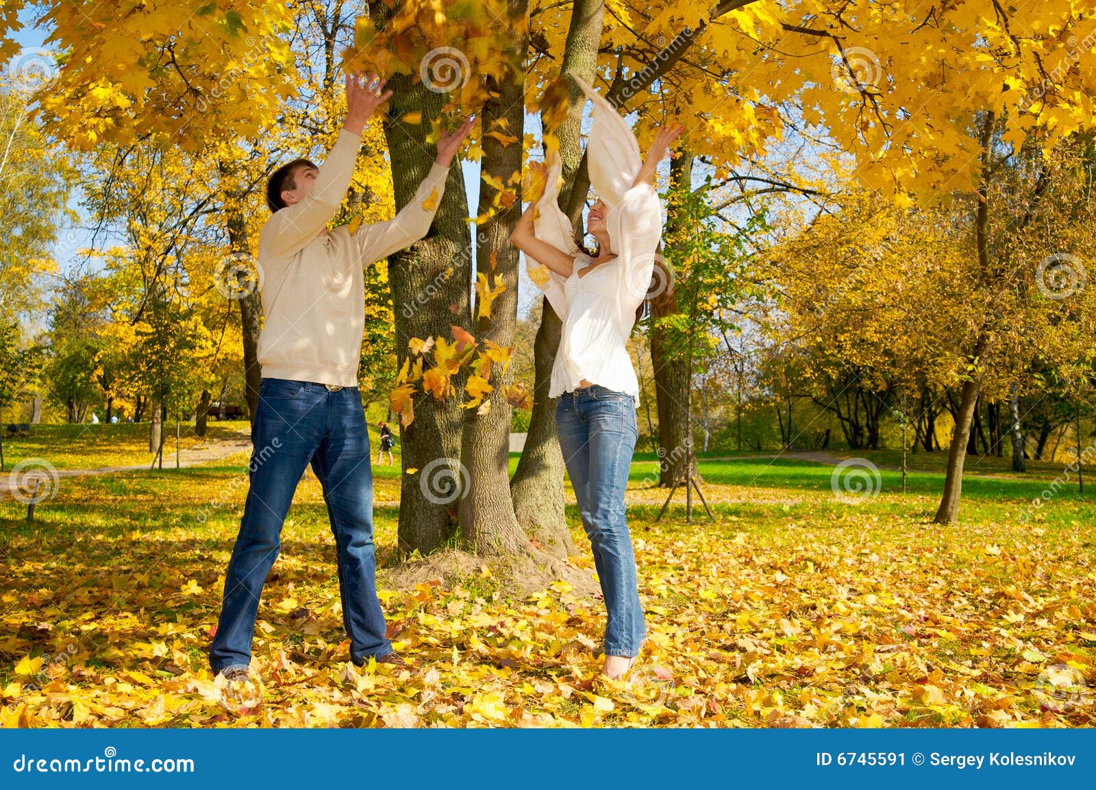 Young Couple Throwing Autumn Leaves Stock Image - Image of lifestyle ...
