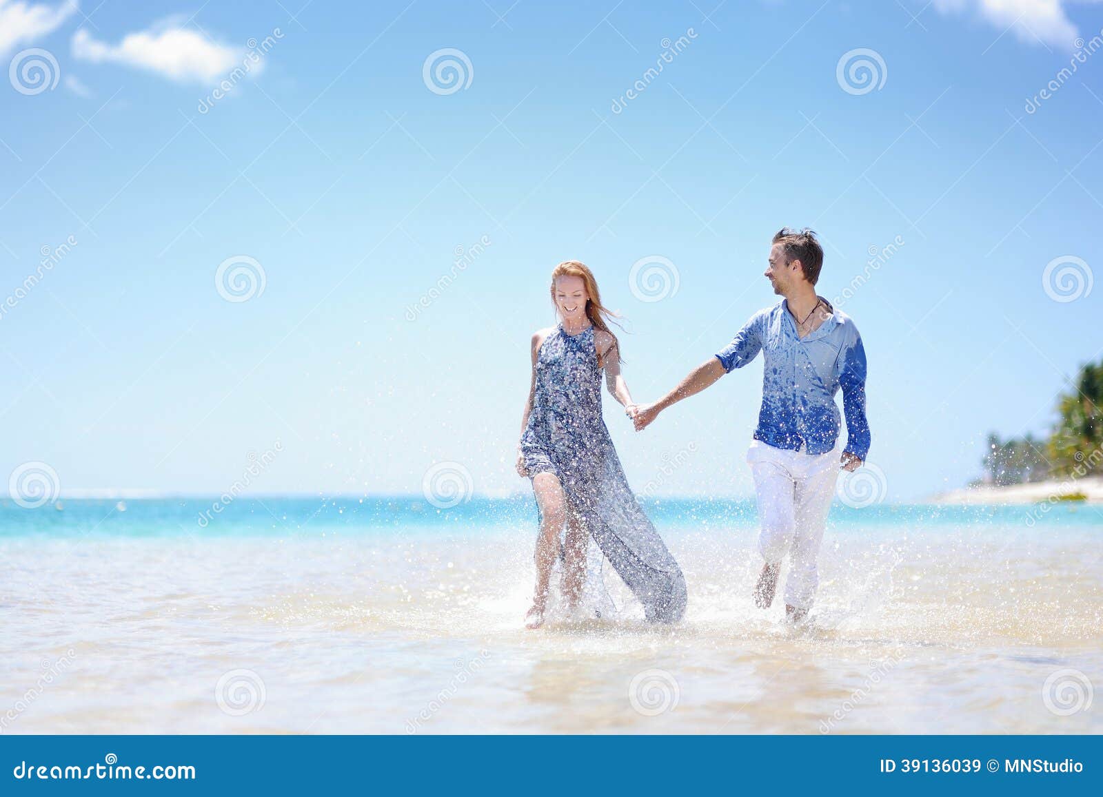 Young Couple on a Tropical Island Stock Image - Image of dress ...