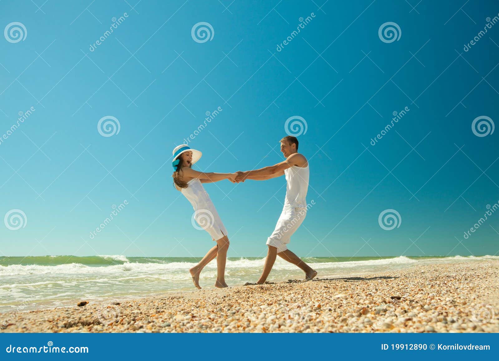 Young Couple Twirling on the Beach Stock Photo - Image of carefree ...