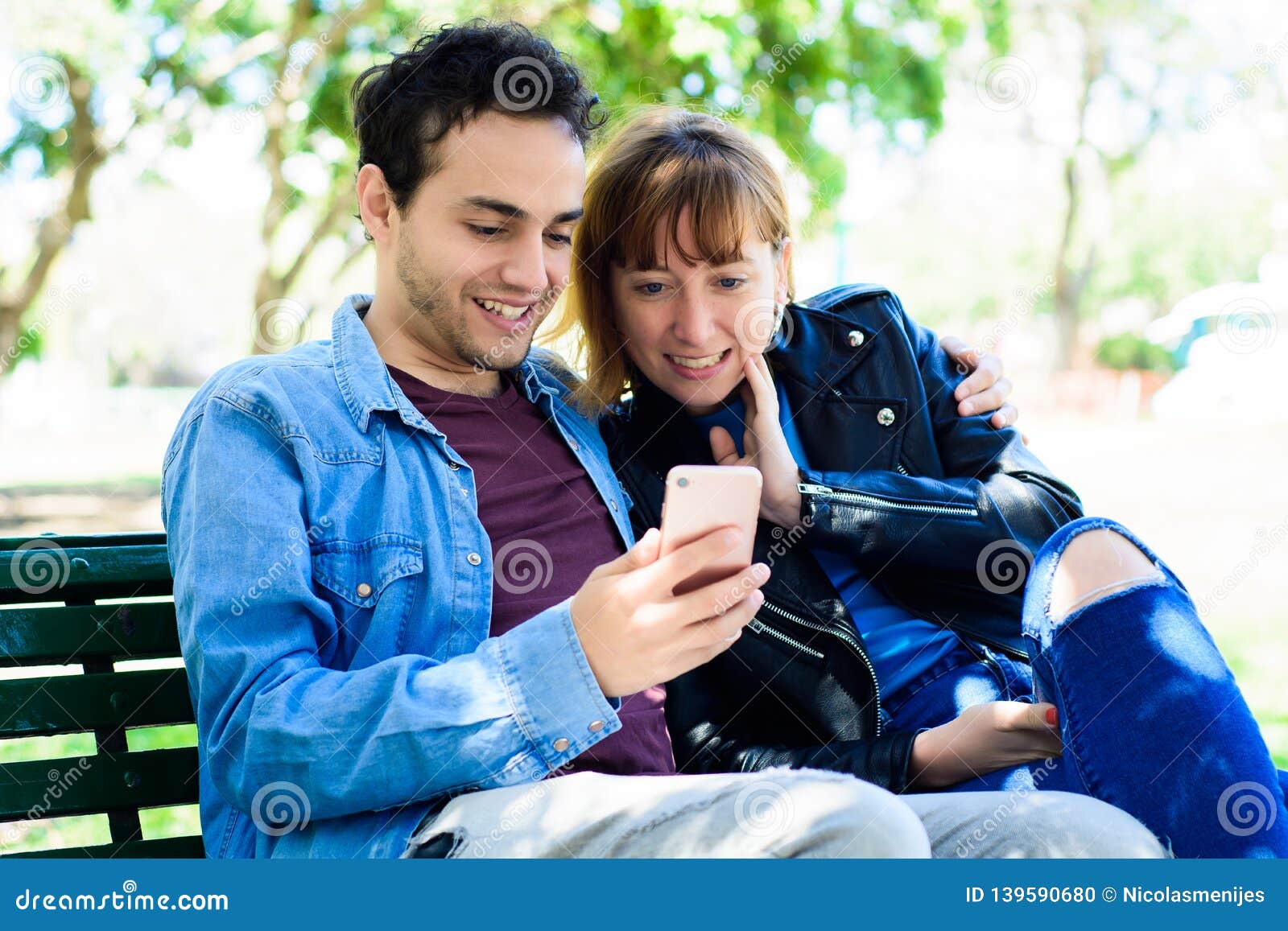 Young Couple Using Application on Smartphone Stock Photo - Image of ...