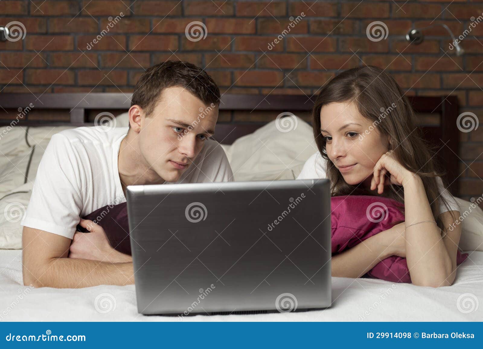 Young couple using laptop stock photo. Image of girlfriend - 29914098