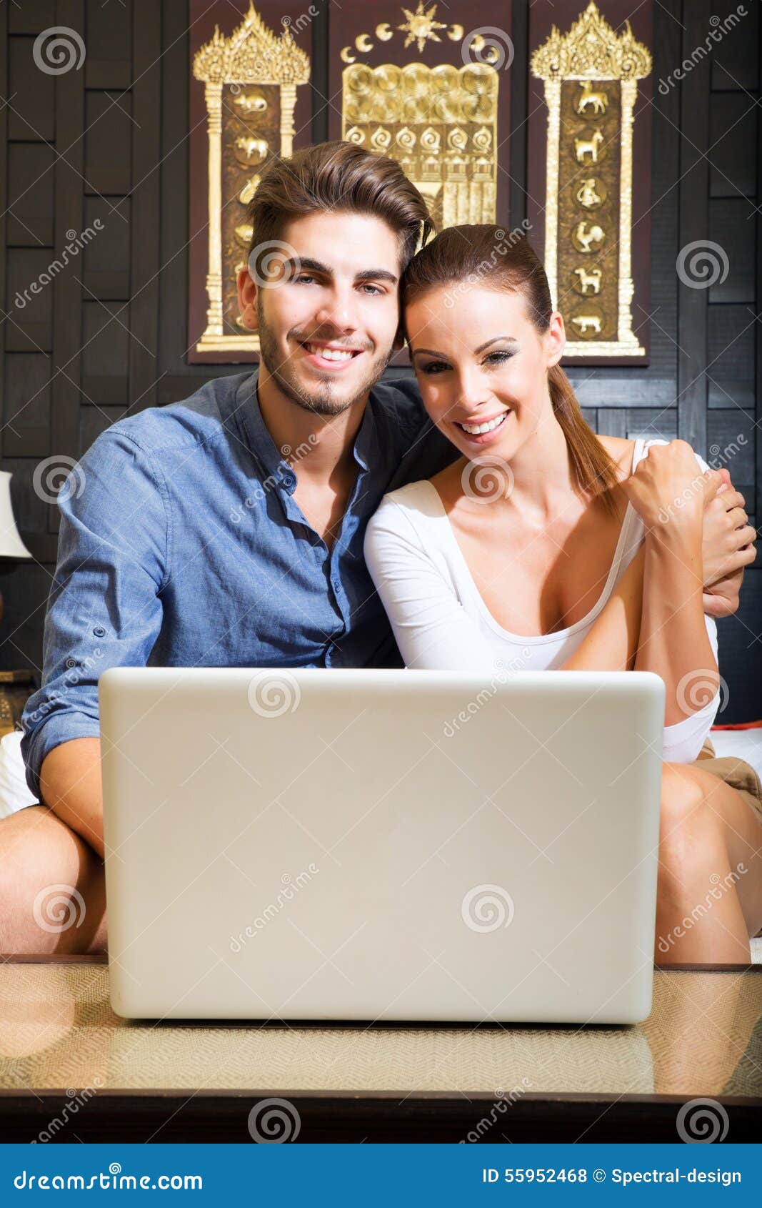 Young Couple Using a Laptop Computer in a Asian Hotel Room Stock Photo ...