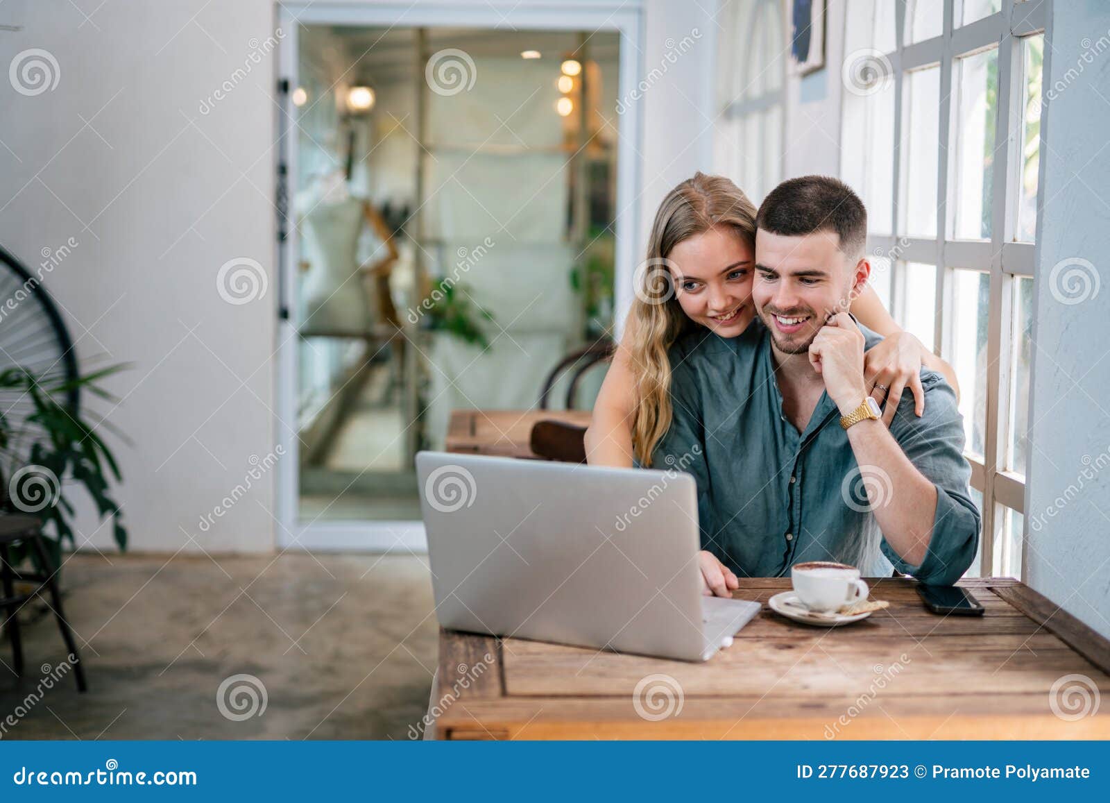 Young Couple Using Laptop on Desk at Home and Think. the Concept of ...