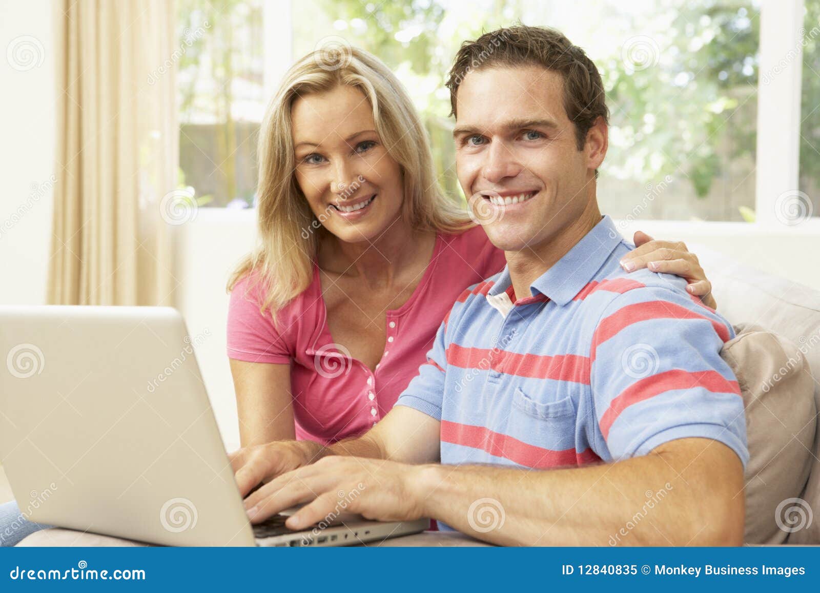Young Couple Using Laptop at Home Stock Image - Image of portrait ...