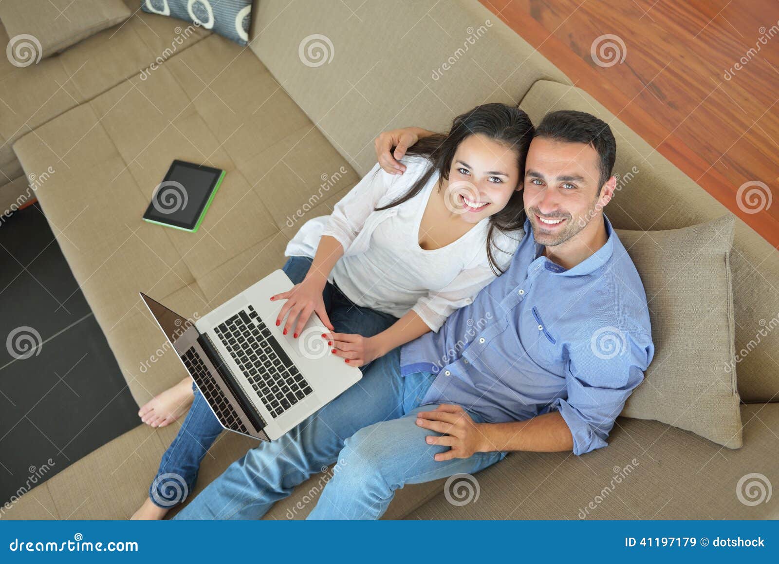 Young Couple Using Laptop at Home Stock Image - Image of indoors, girl ...